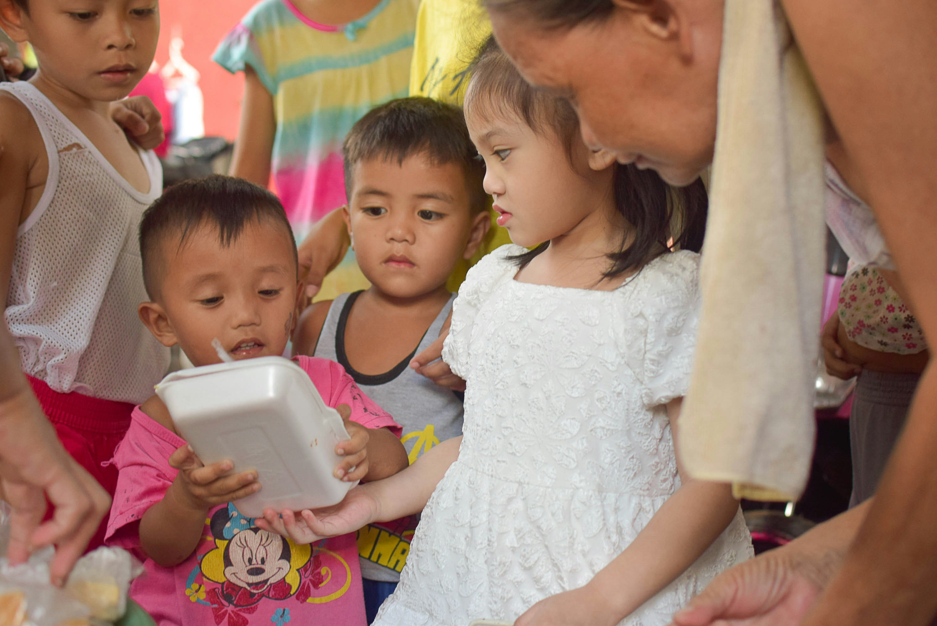 A group of children standing around each other photo – Free People ...