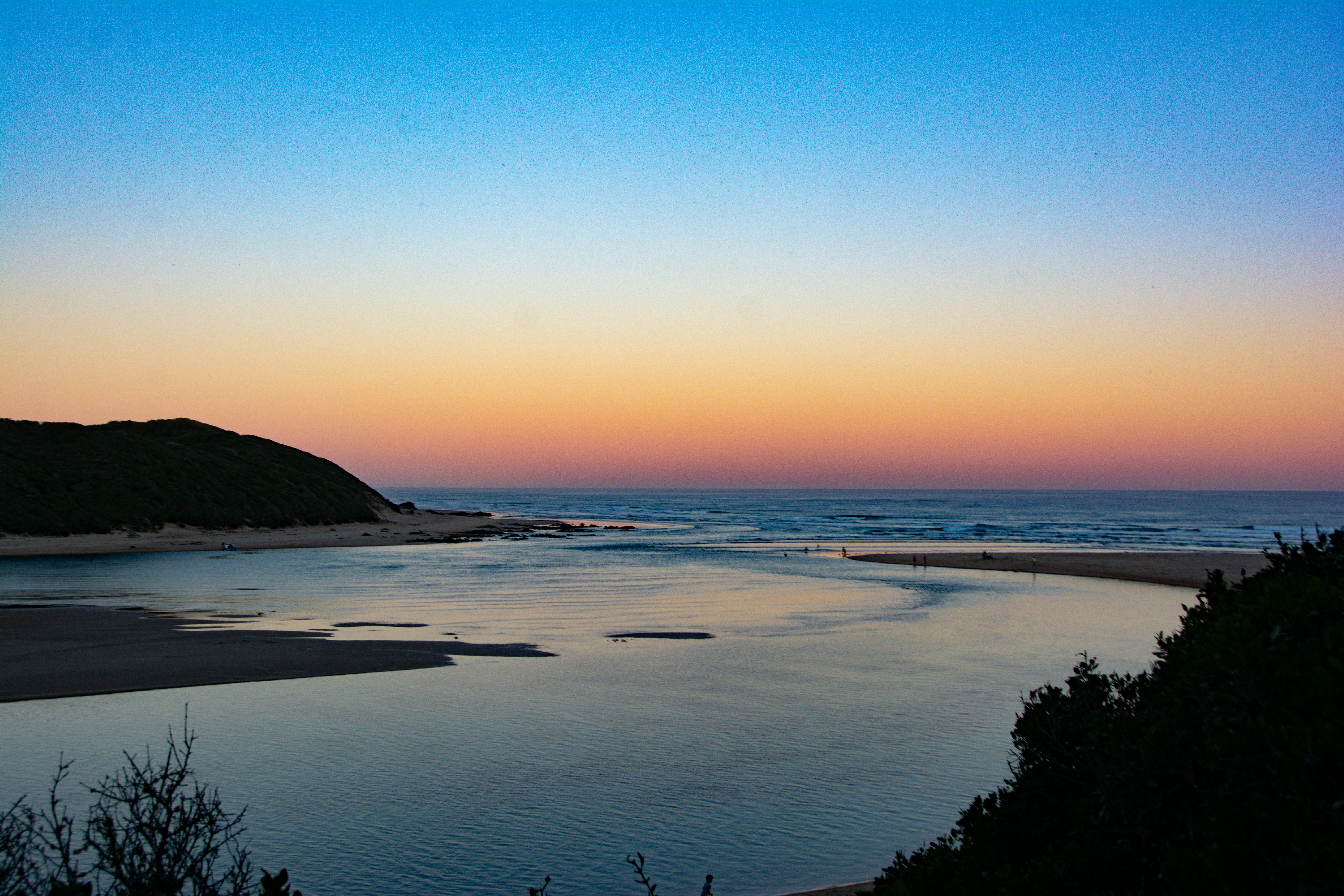 Twilight Confluence: Quiet Beach at Sunset