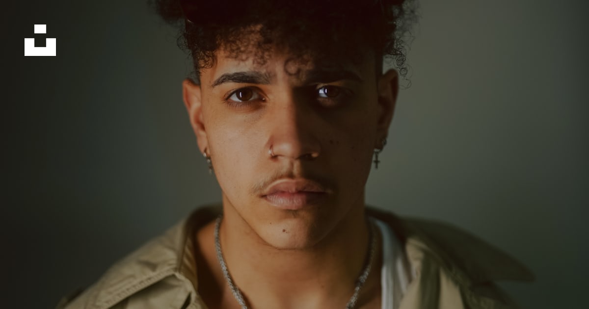 A Man With A Necklace On His Neck Photo Free Portrait Image On Unsplash