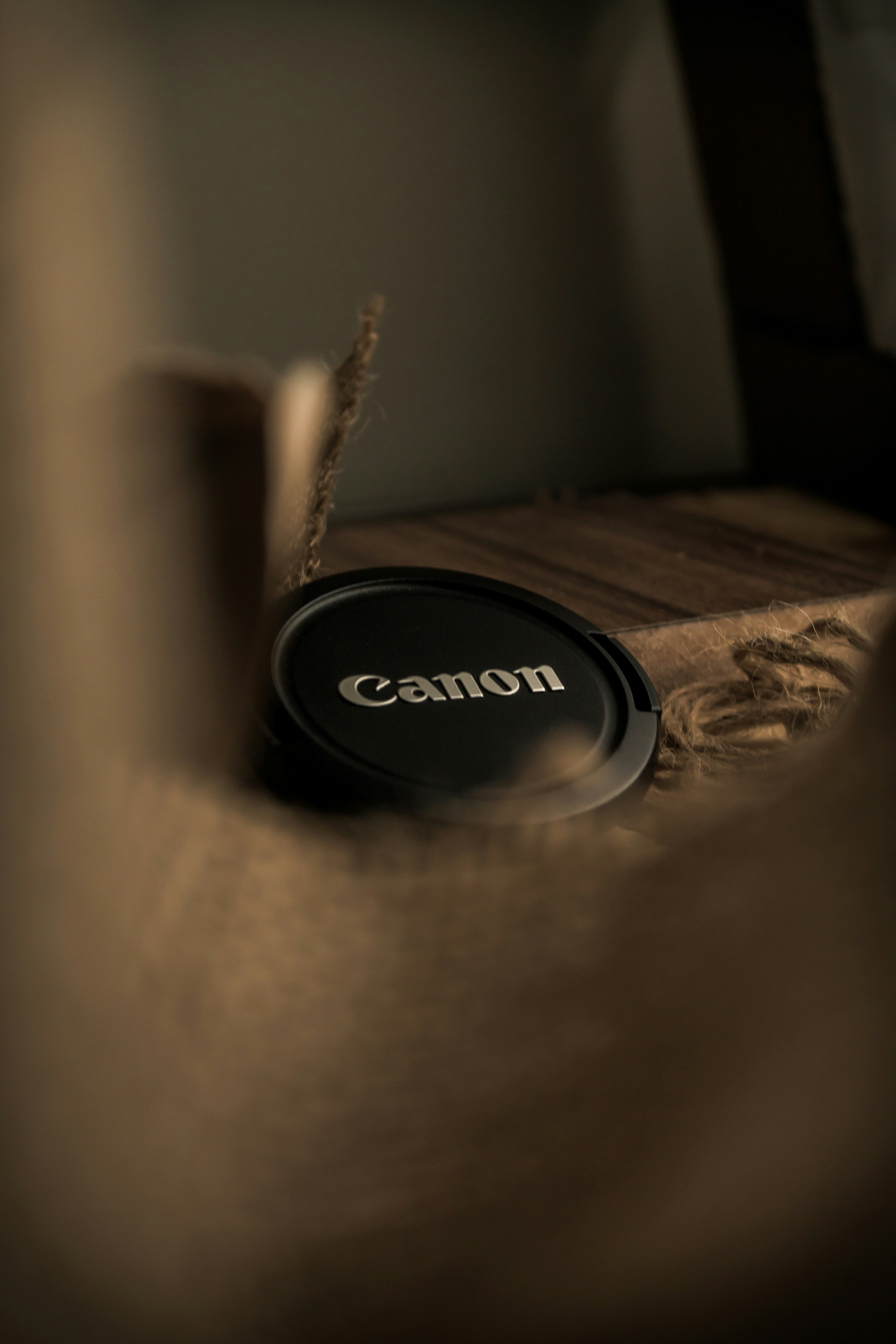 A close up of a camera lens cap photo – Free Wooden Image on Unsplash