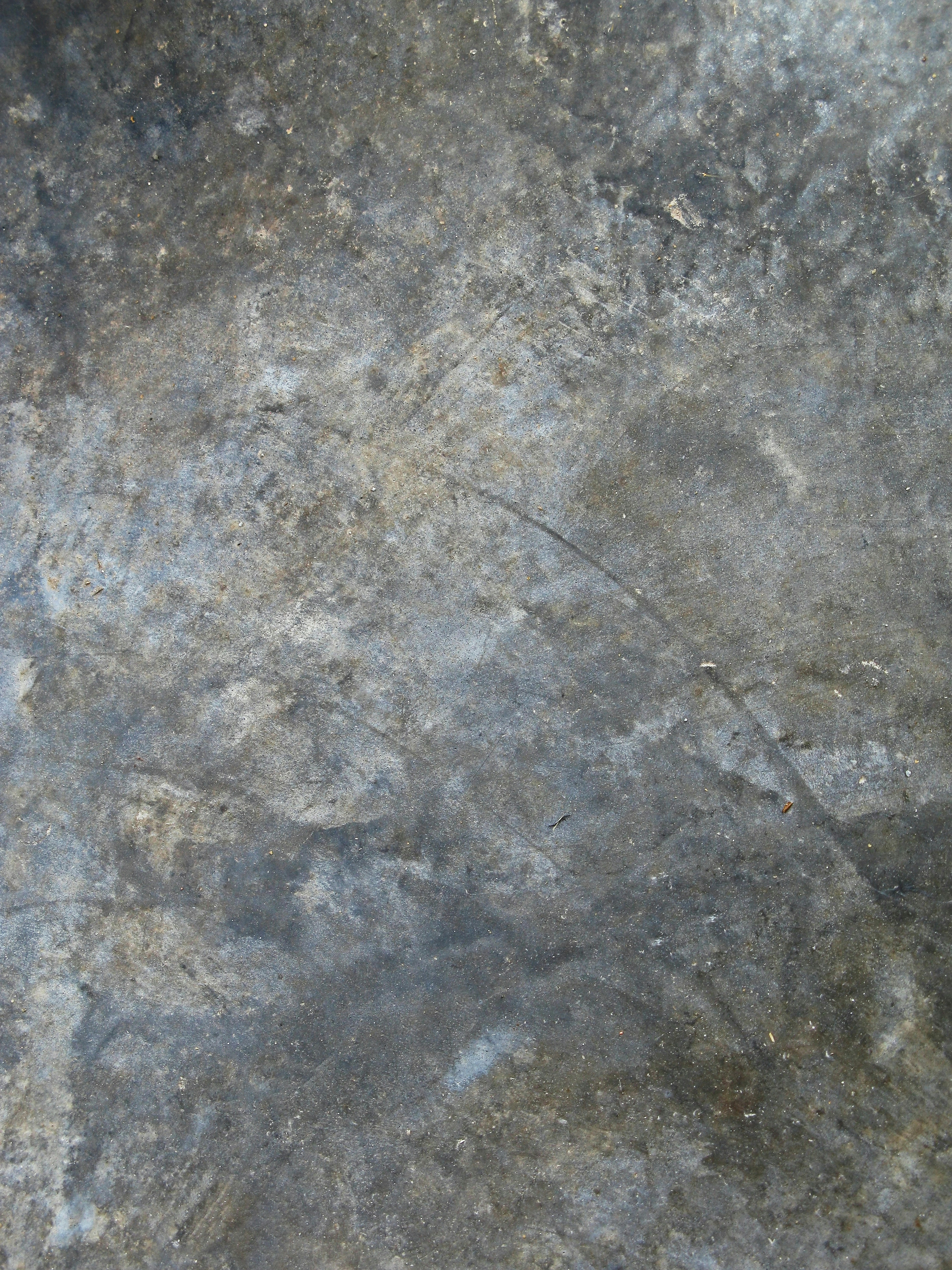 A close up of a cement surface with cracks photo – Free Texture Image ...