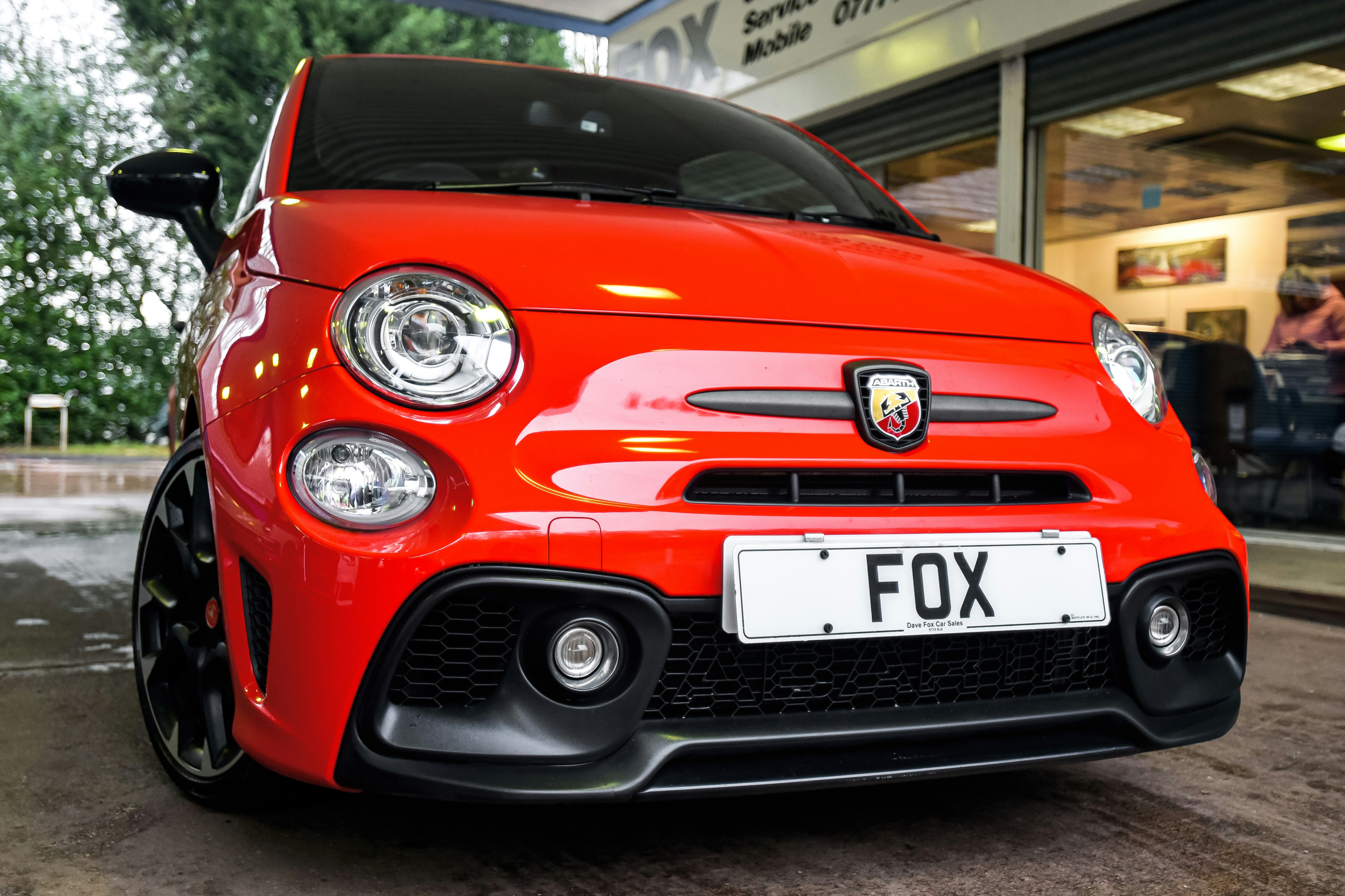 A red car parked in front of a building photo – Free Dave fox cars Image on Unsplash
