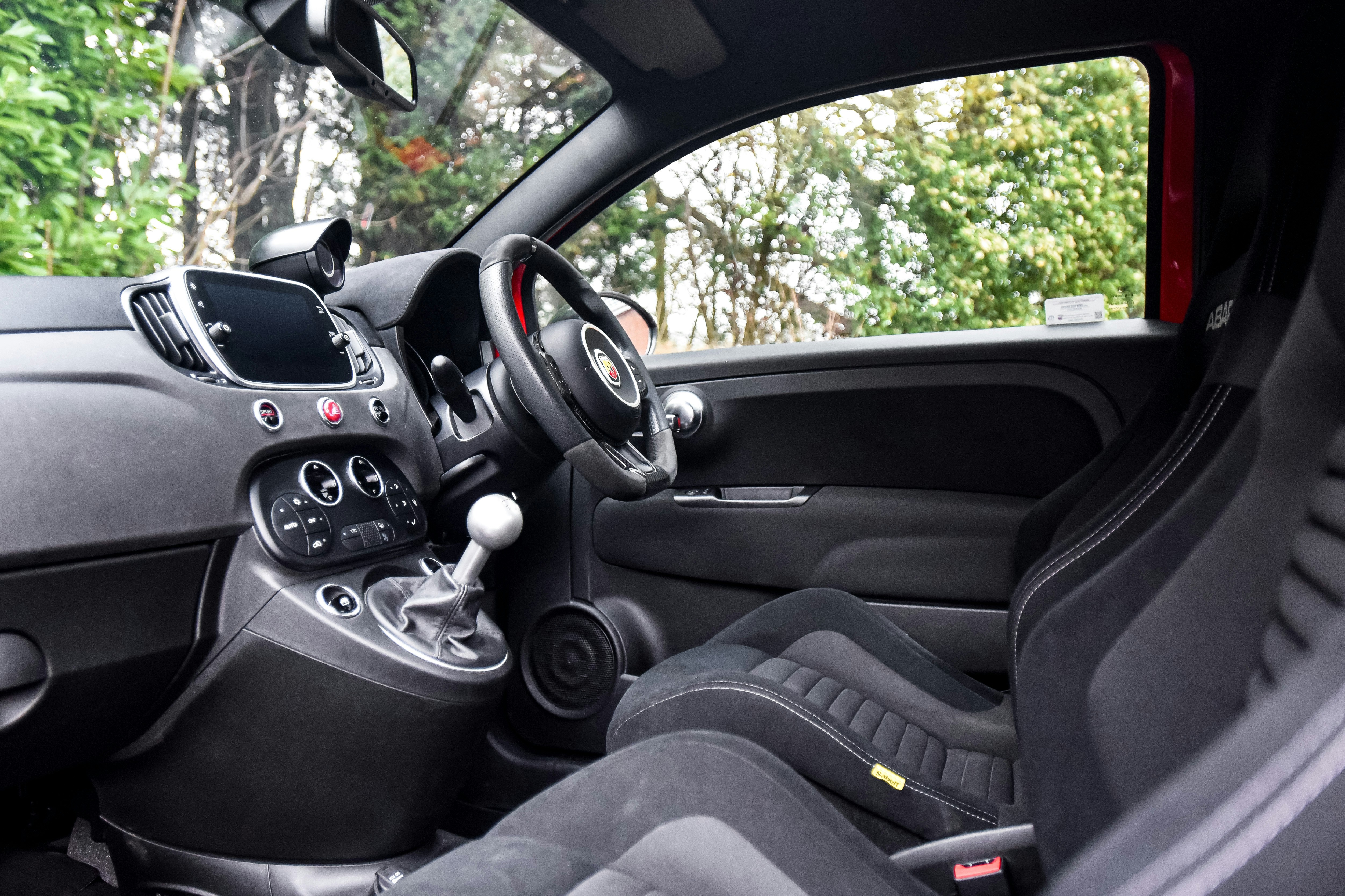 The interior of a car with a steering wheel and dashboard photo – Free ...