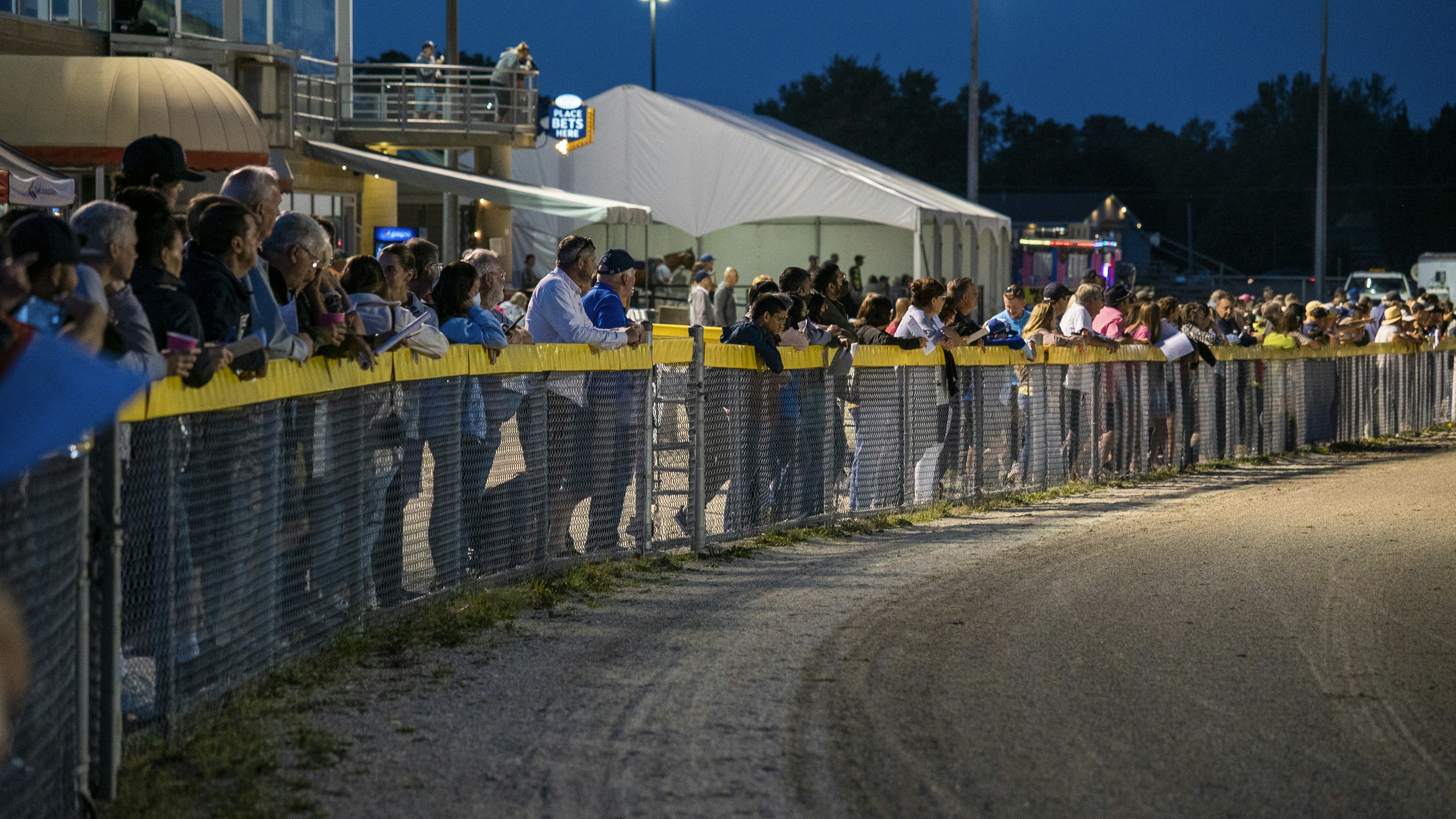 A crowd of people watching a race at night photo – Free Grand river ...