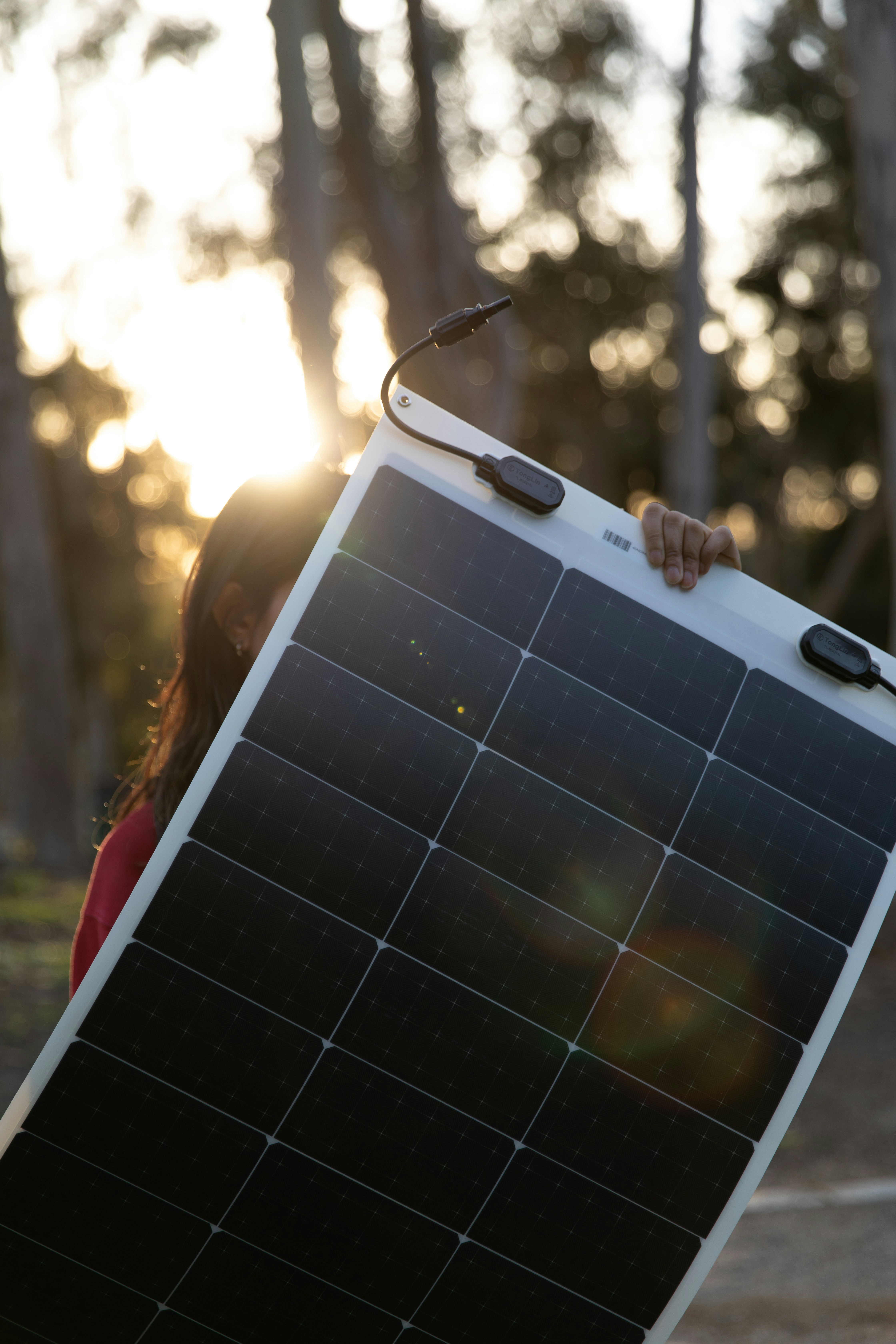 A person holding a solar panel with a microphone photo – Free Outdoors ...