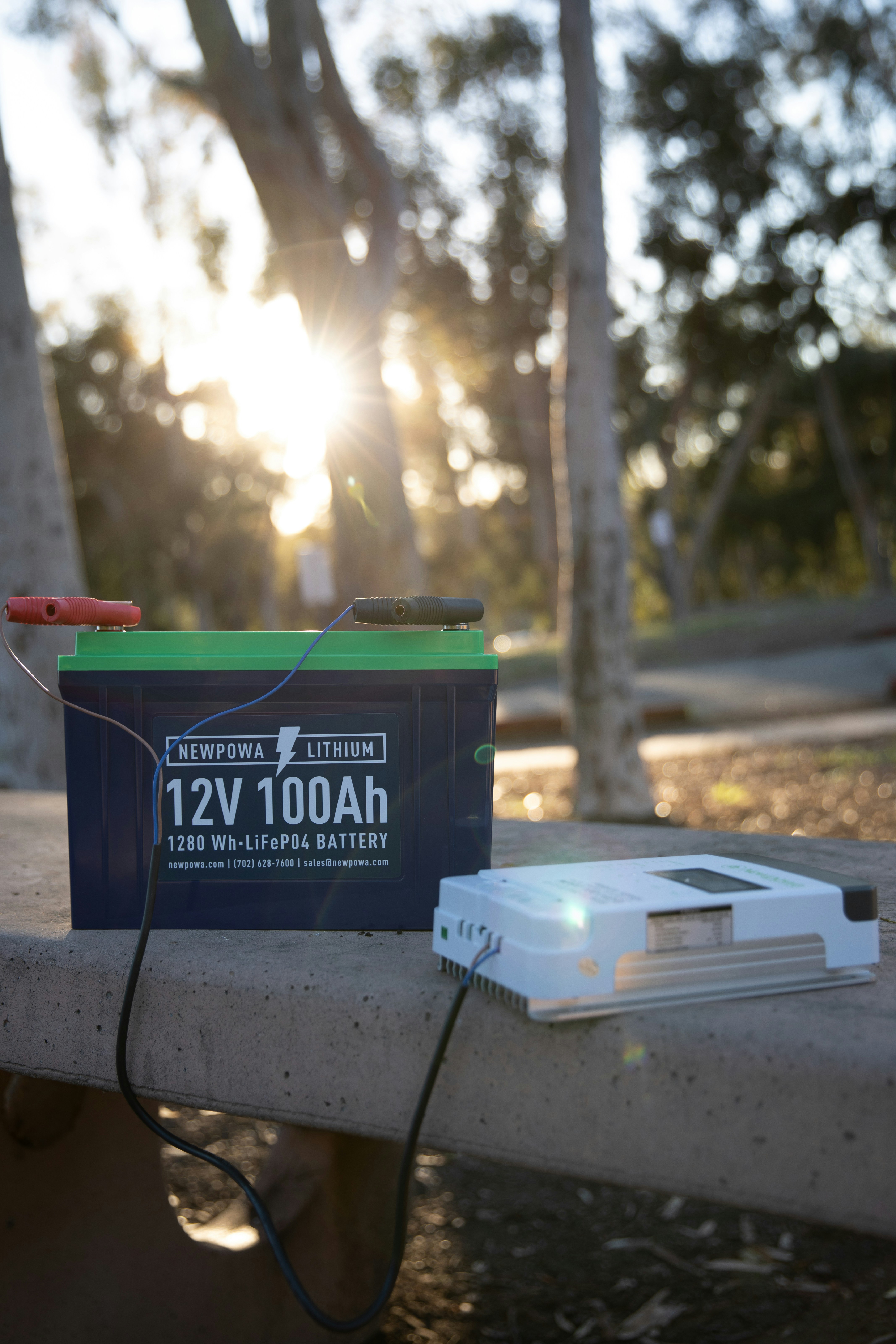 A battery and a charger sitting on a ledge photo – Free Soil Image on ...