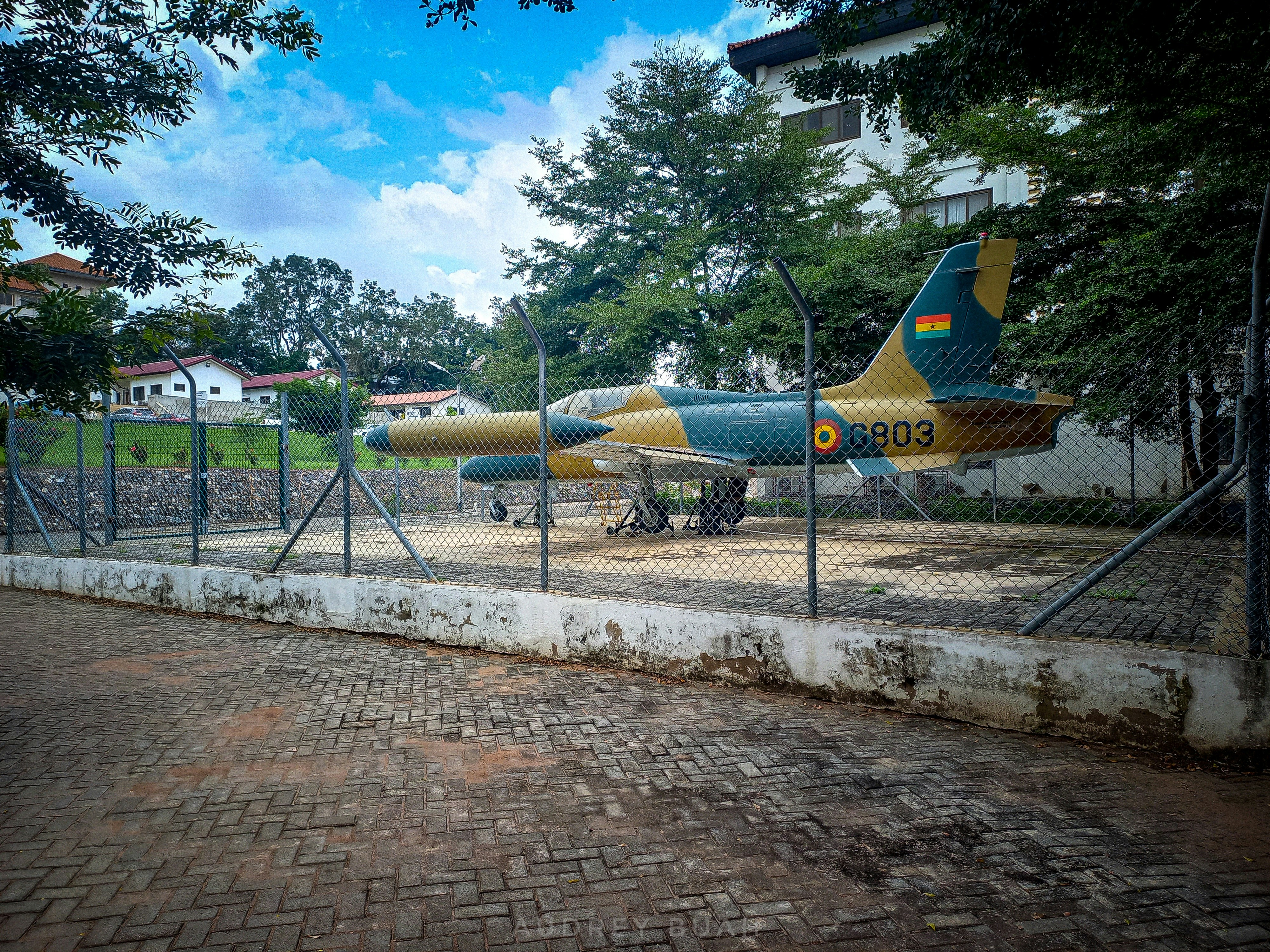 Abandoned aircraft on a quiet perimeter: a chipped memory behind the fence