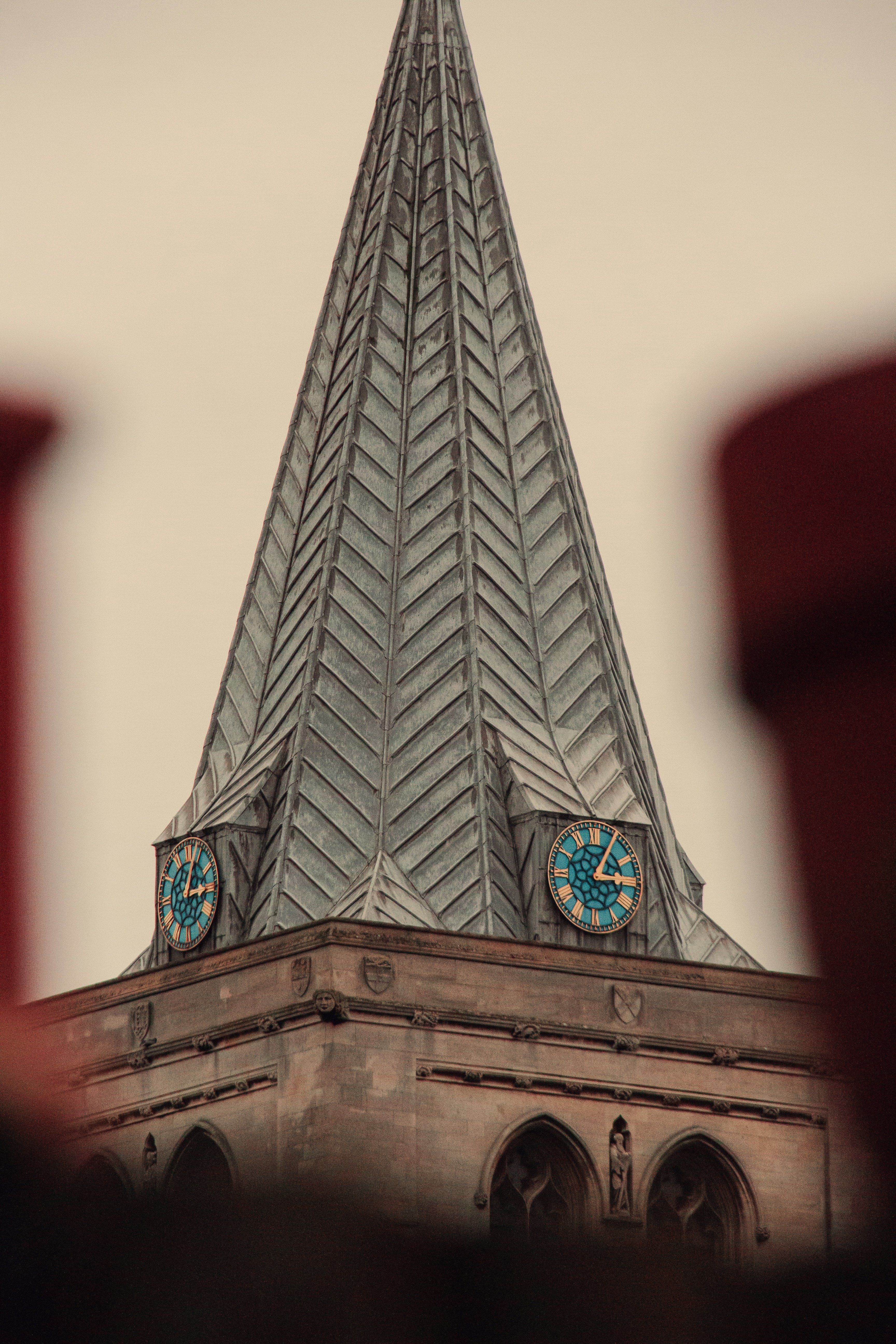 Clocktower Needle: A Gothic Peak Framed by Foreground Blur
