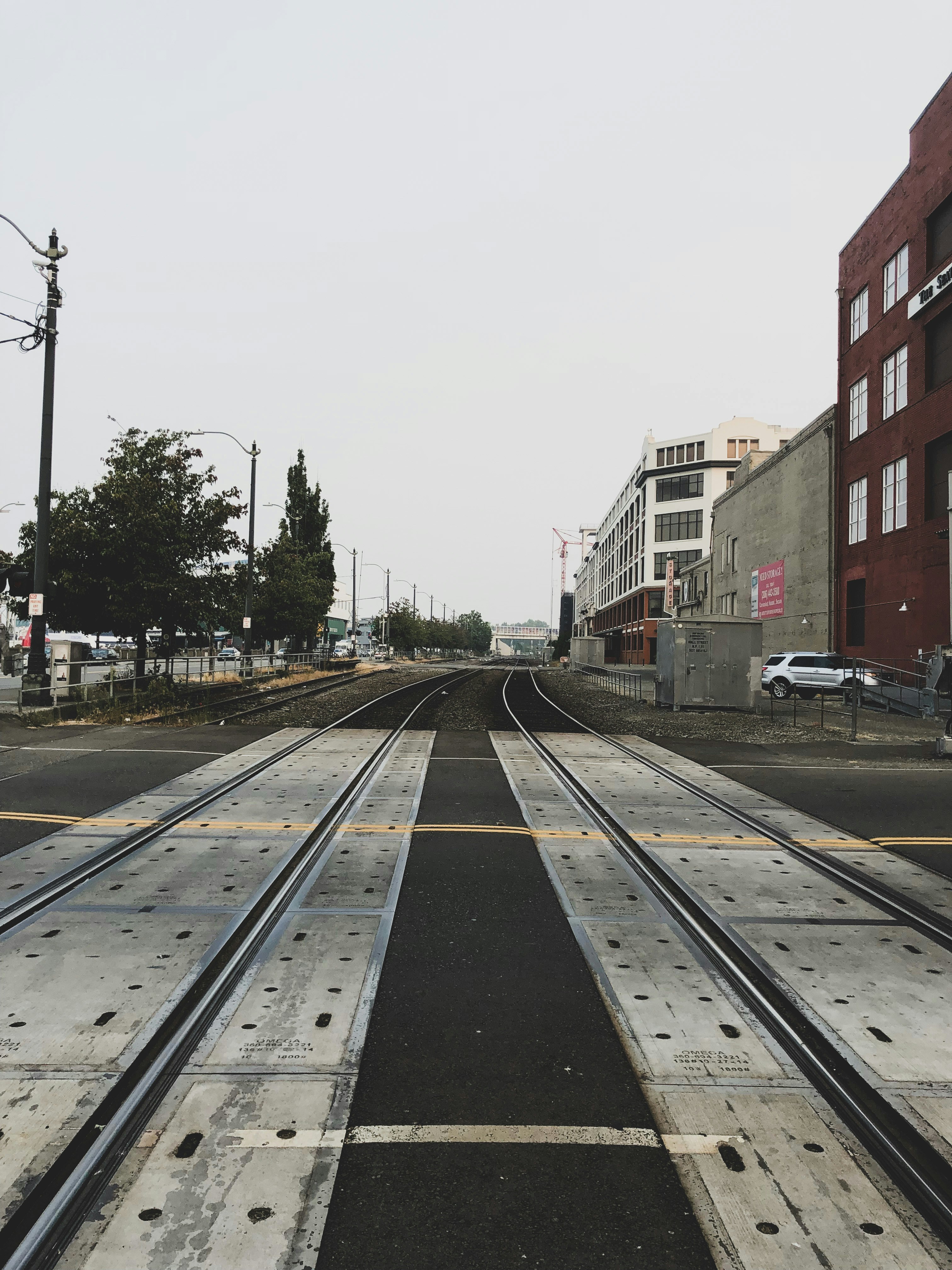 A train track with a building in the background photo – Free Seattle ...