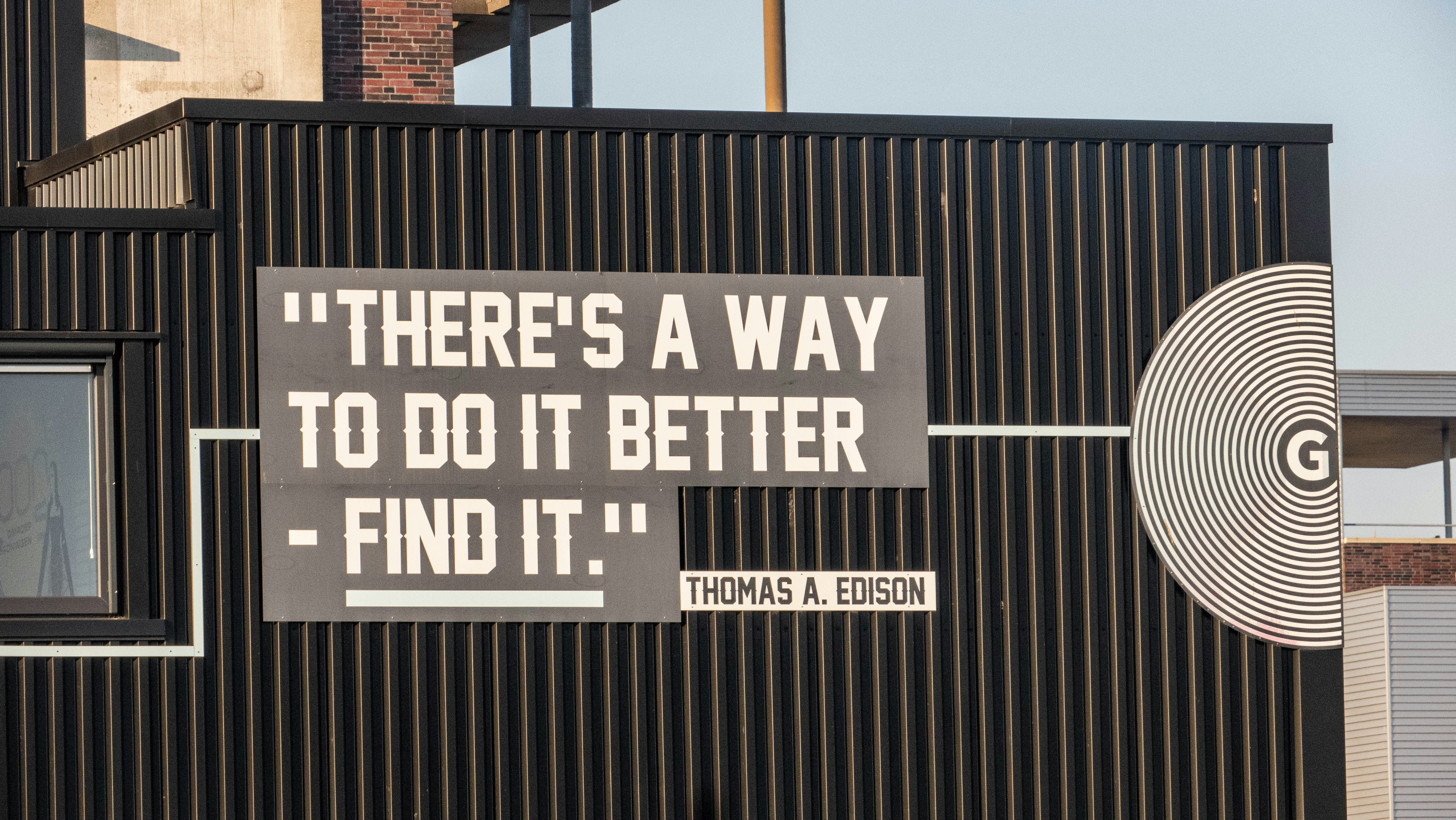 There is a sign on the side of a building photo – Free Interior design ...
