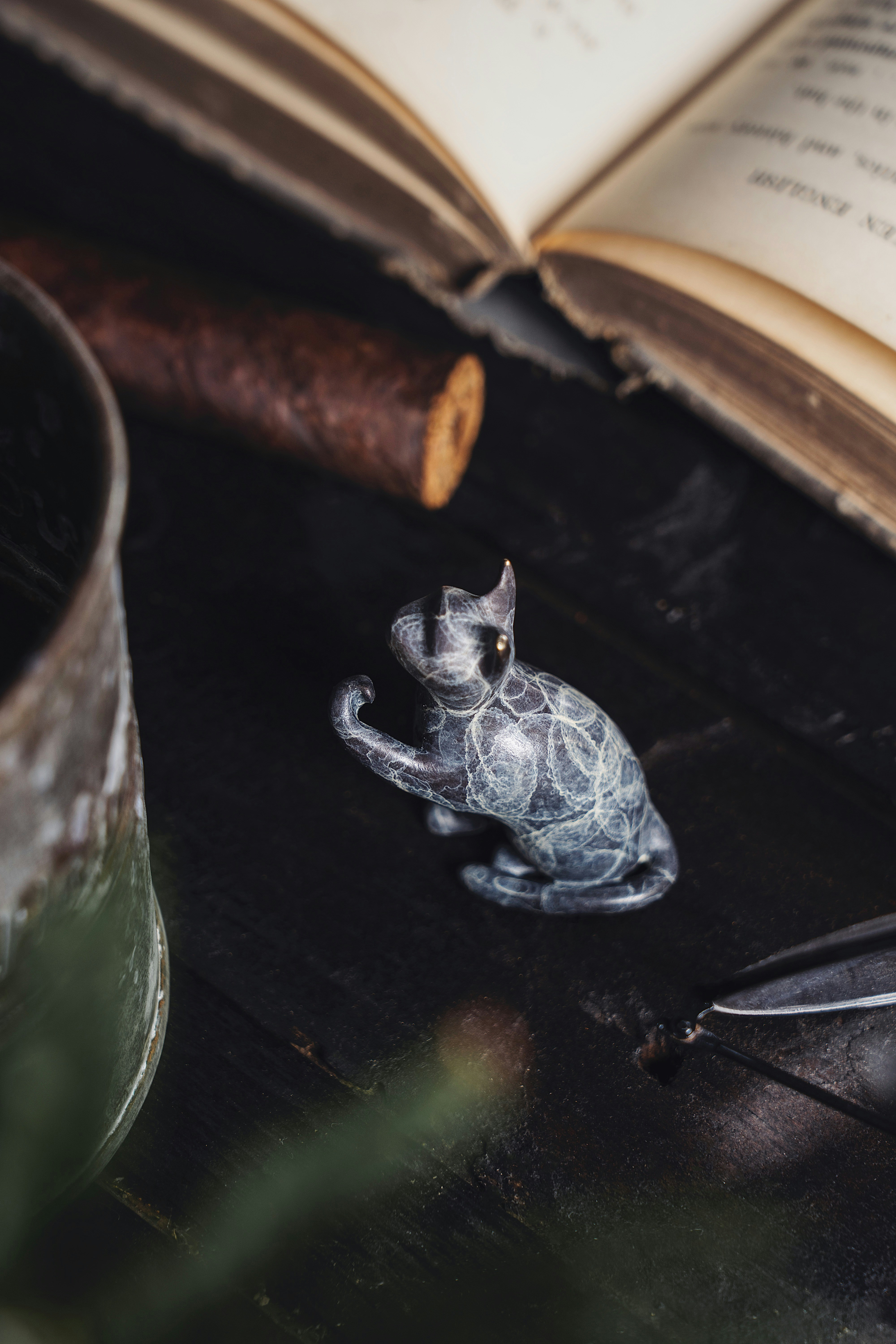 Whisper of Marble: A Tiny Cat Emerges from Shadows