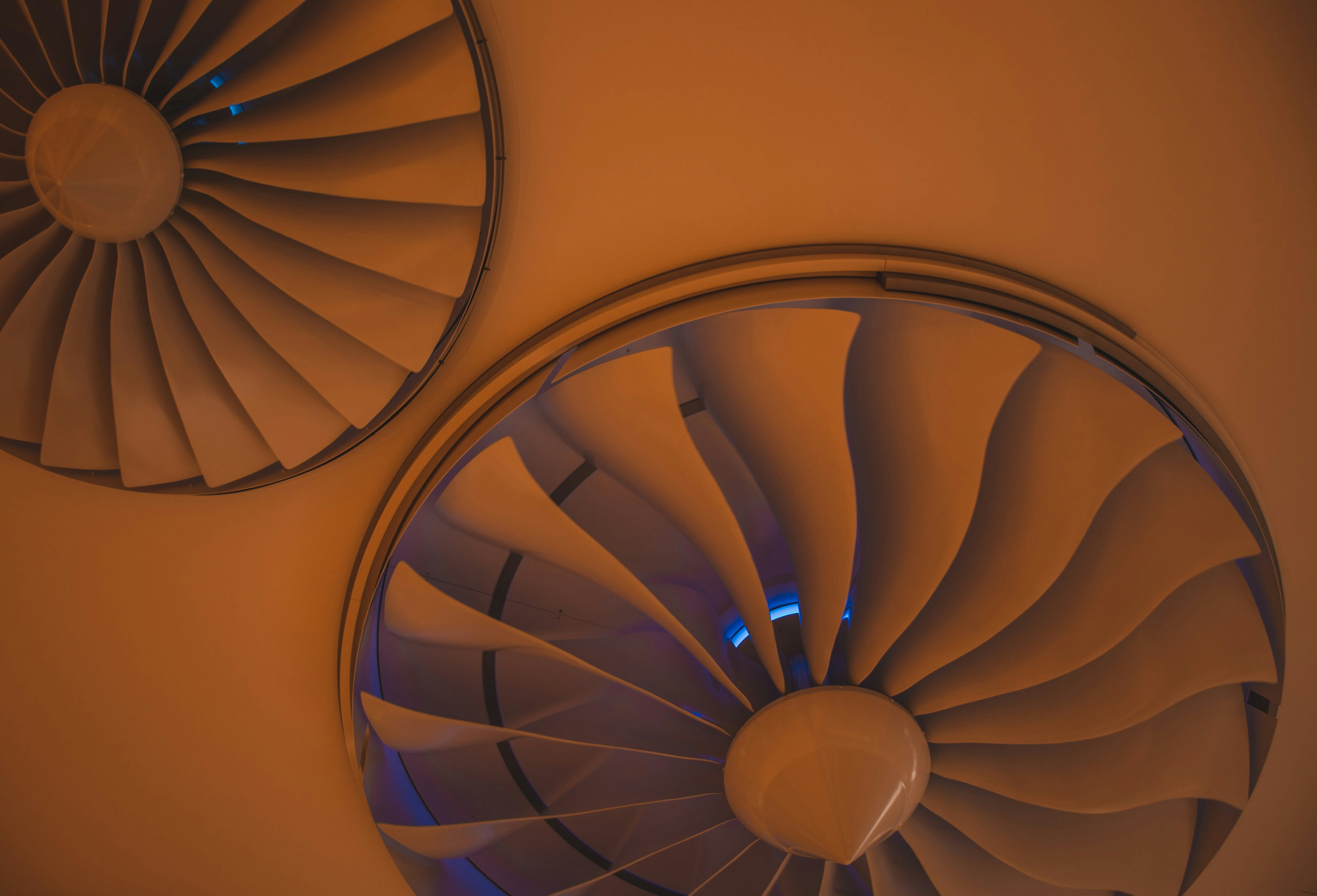 Amber Aegis: Close-Up of Dual Turbine Fans Under Warm Glow