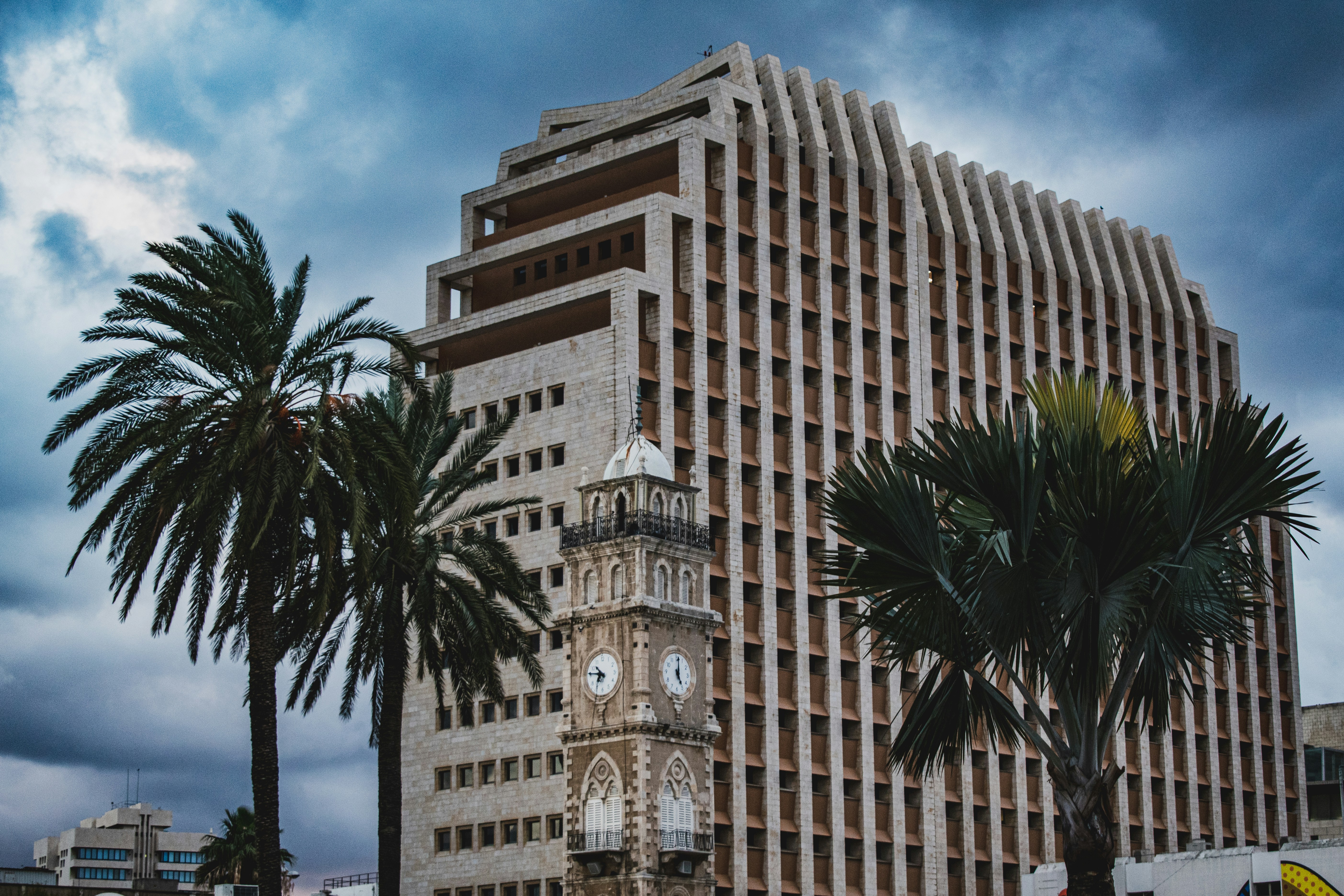 a tall building with a clock on the front of it