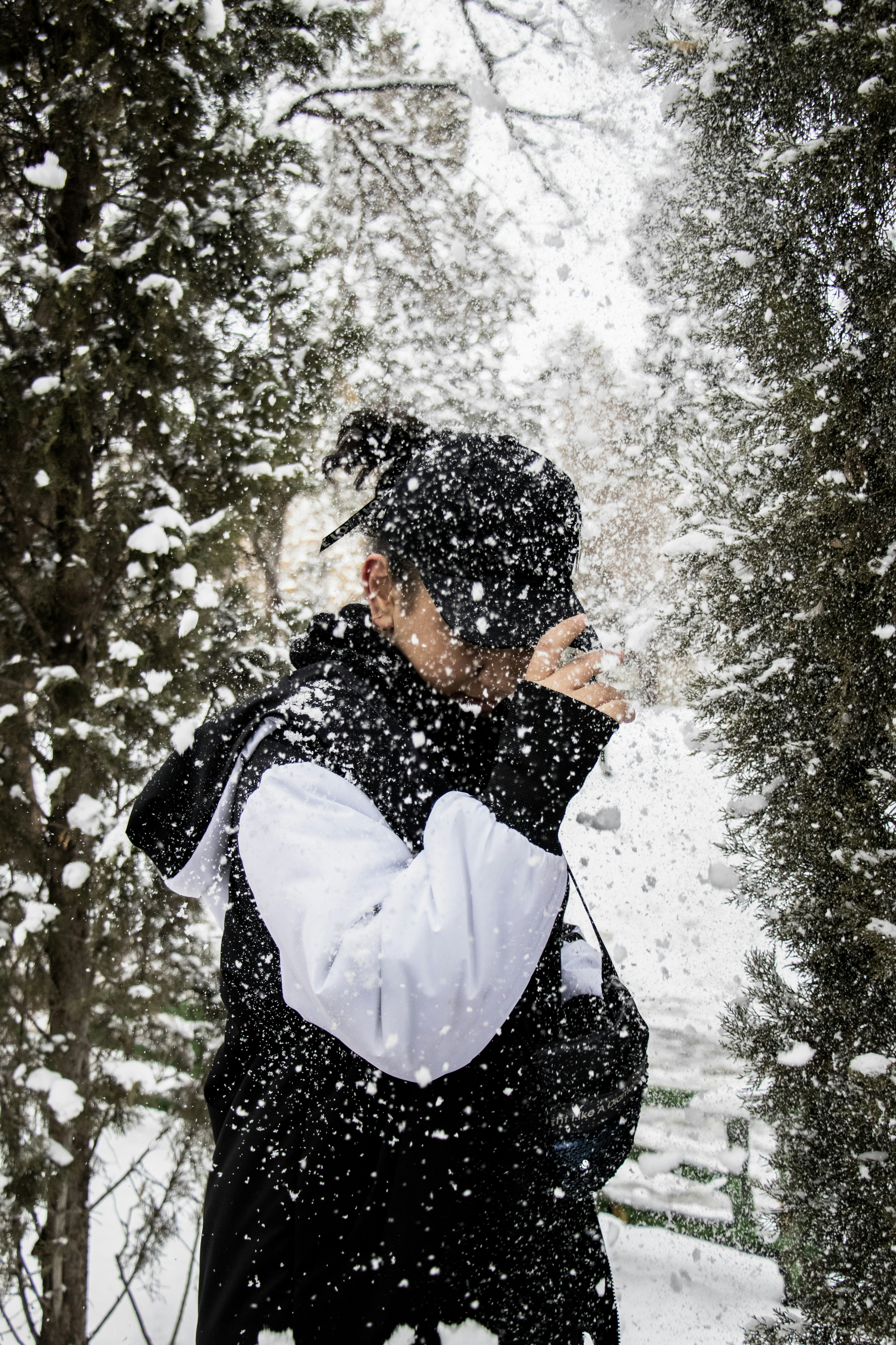 a person standing in the snow taking a picture