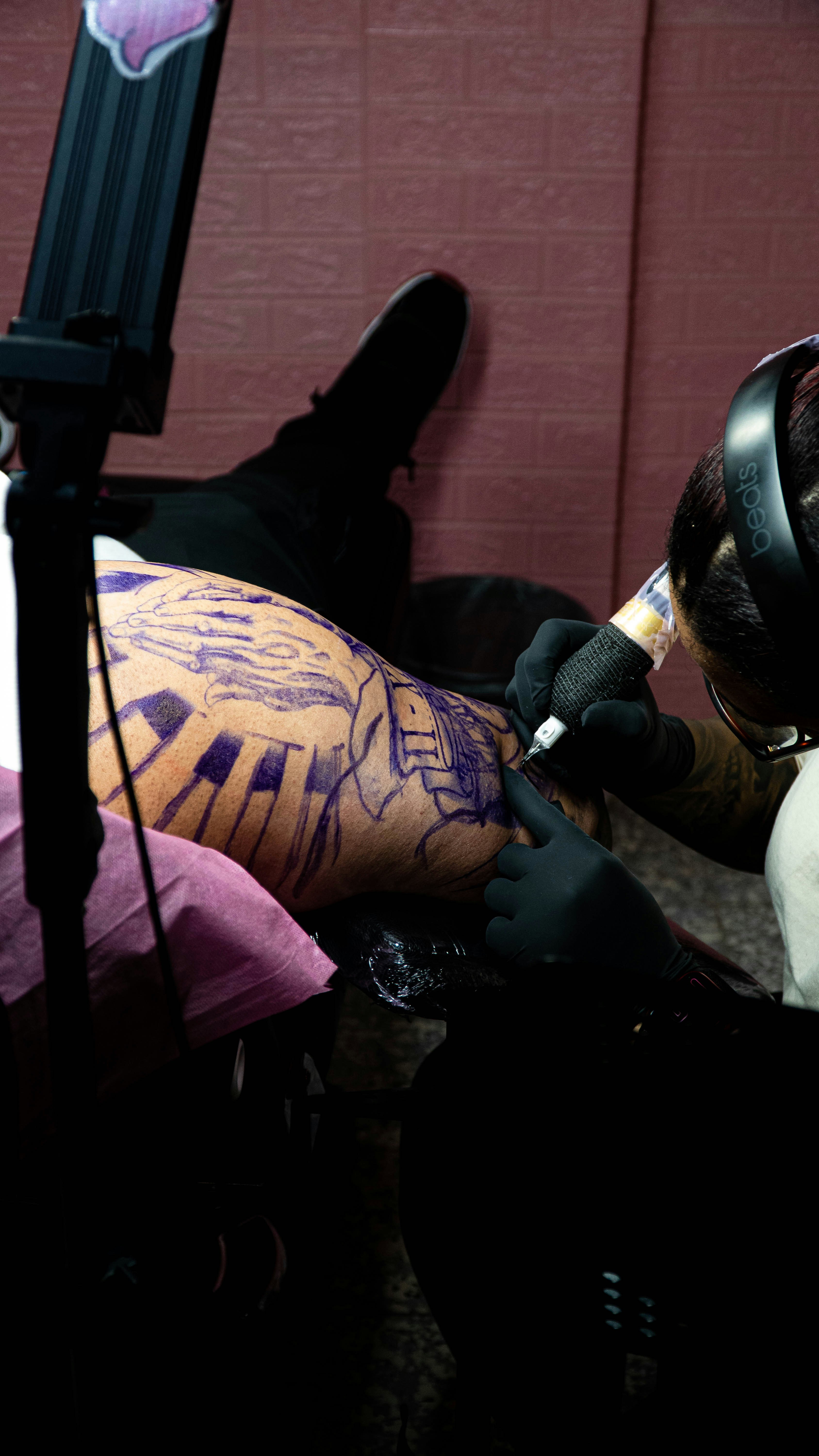 a man with a tattoo on his leg