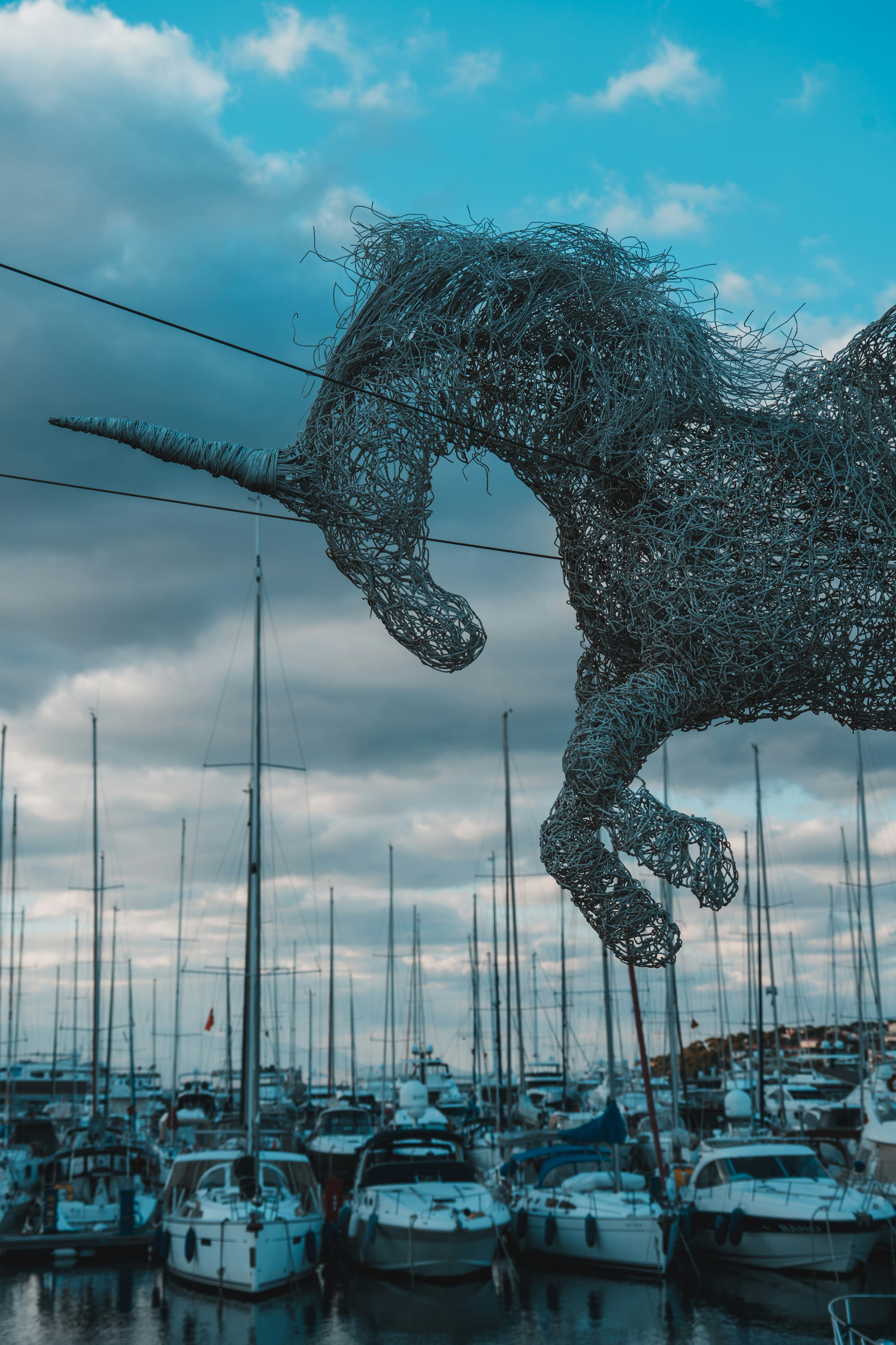 Wireframe Mare Over Marina: A Sculptural Leap Above Boats