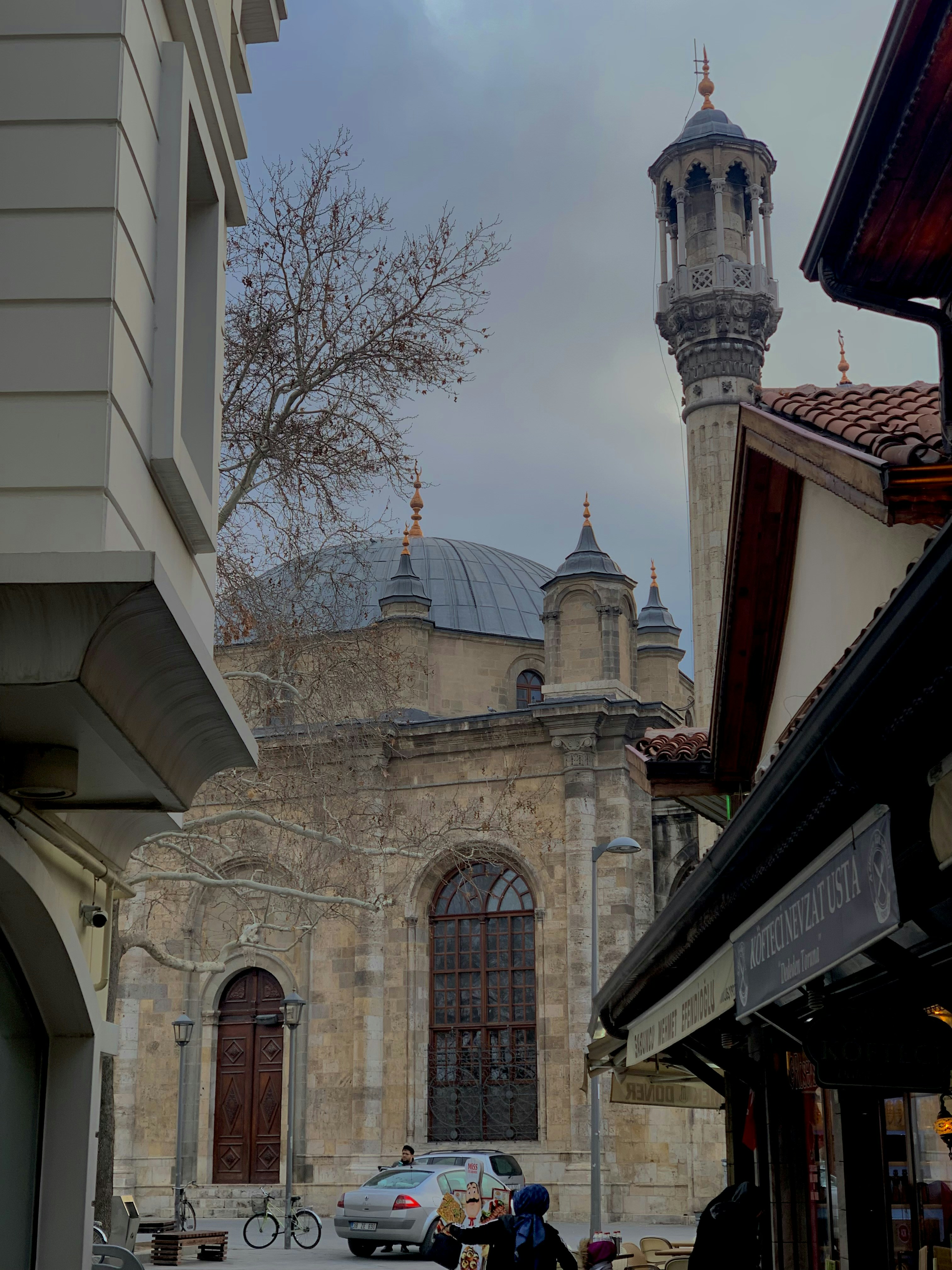 Dome Behind a Narrow Street: A Historic Facade Framed by Marketfront