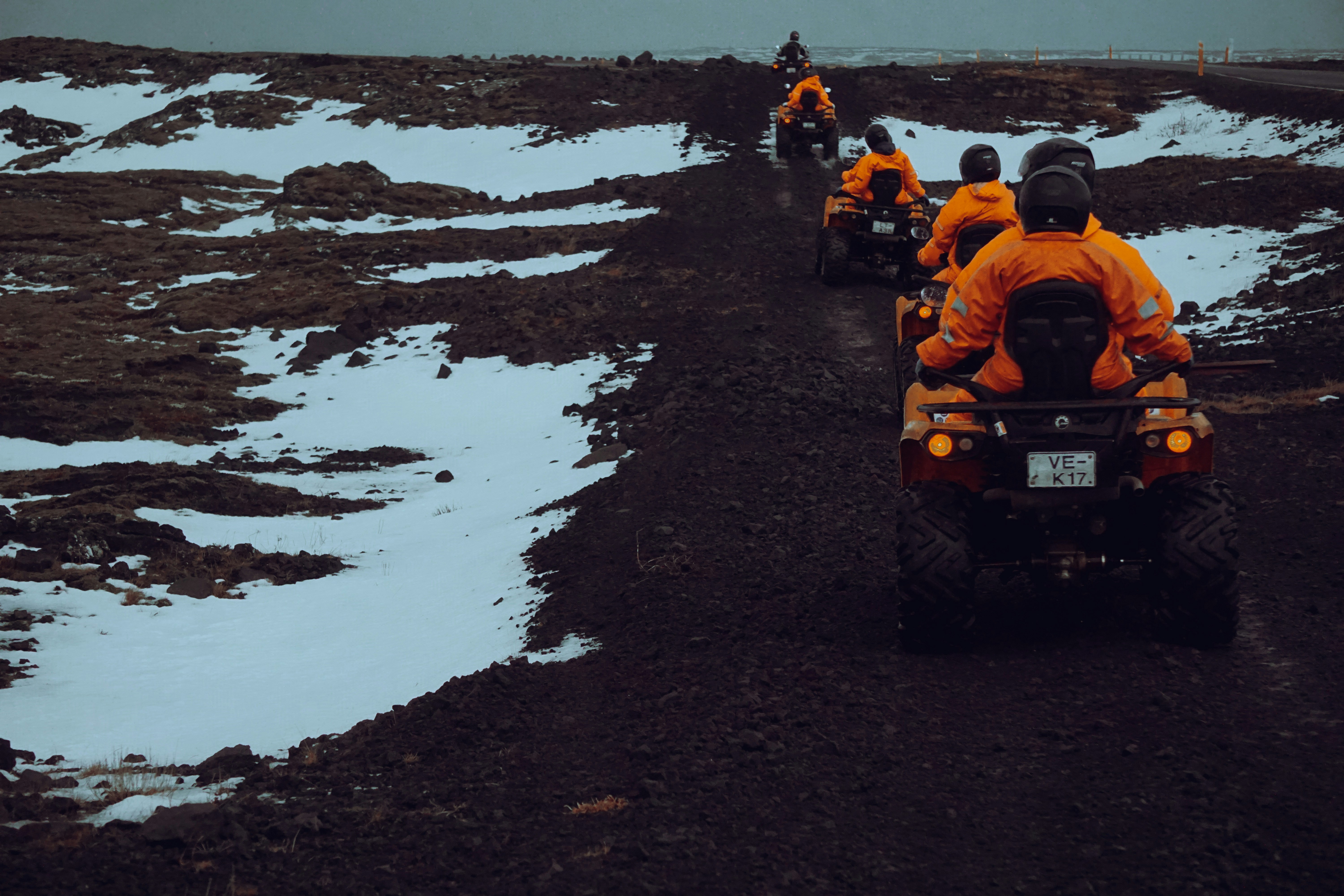 A group of people riding on the back of four wheelers photo – Free ...