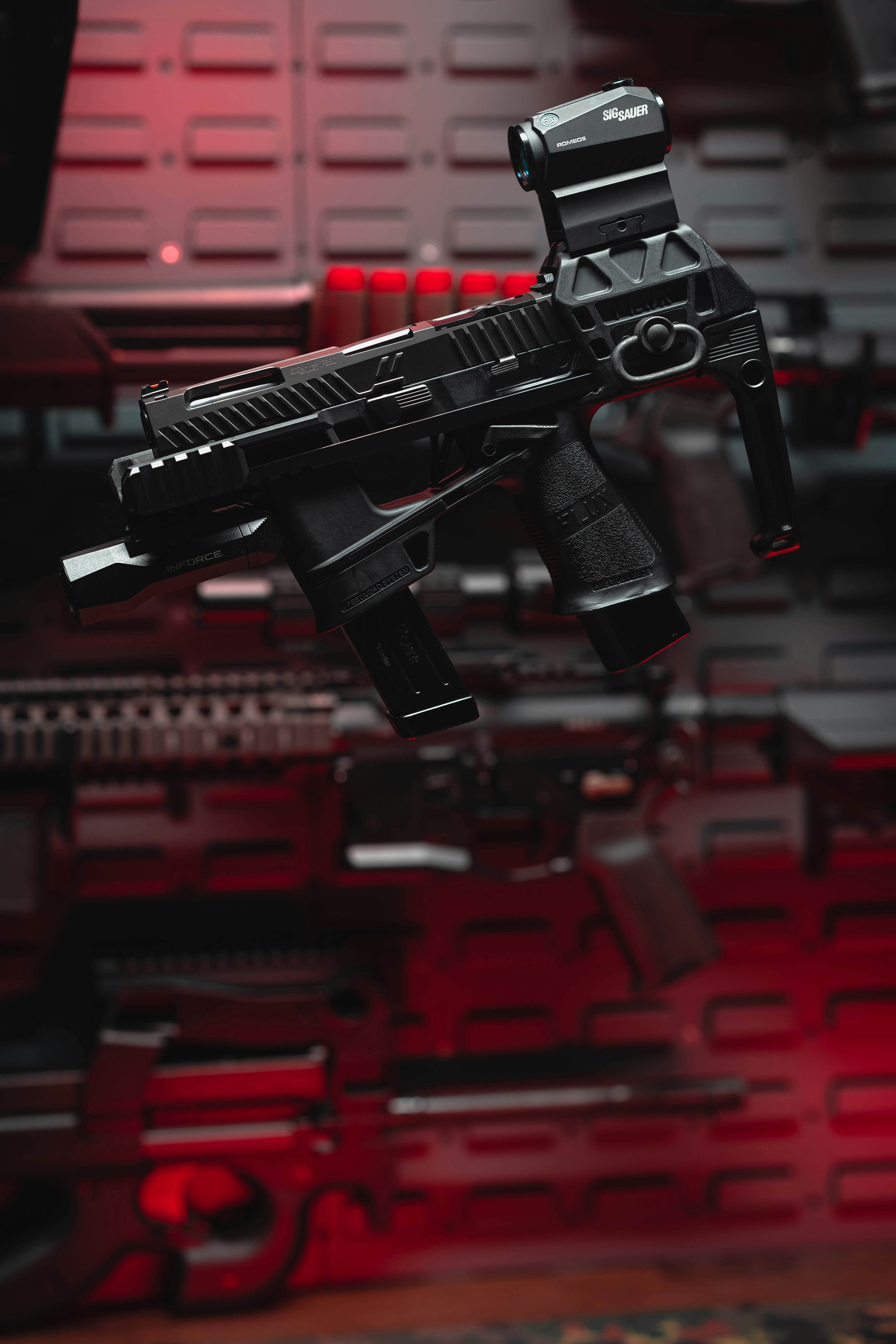 A toy gun hanging from the ceiling of a room photo – Free Handgun Image ...