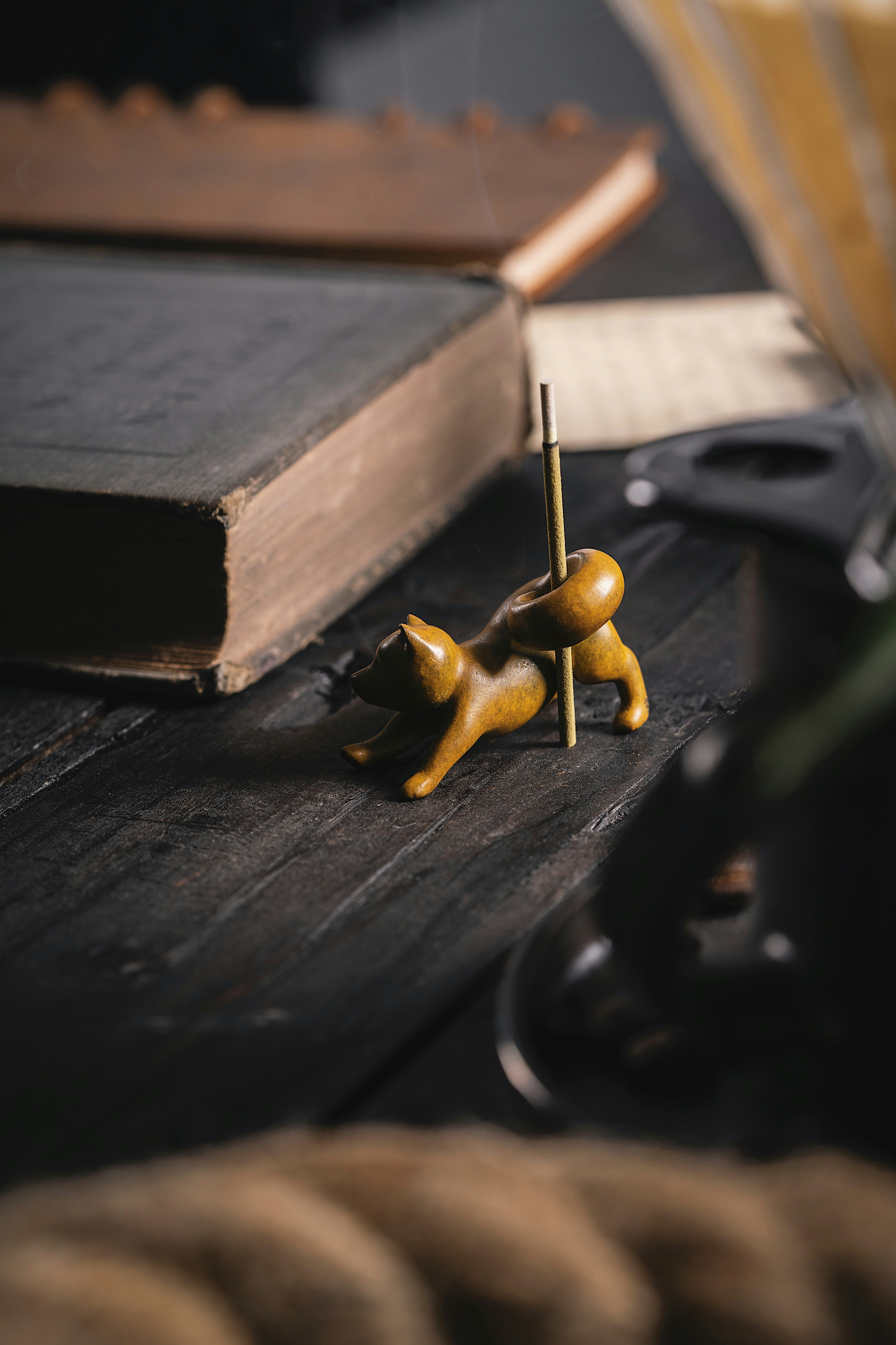 Pinned Duo on a Weathered Desk: A Tiny Brass Still Life