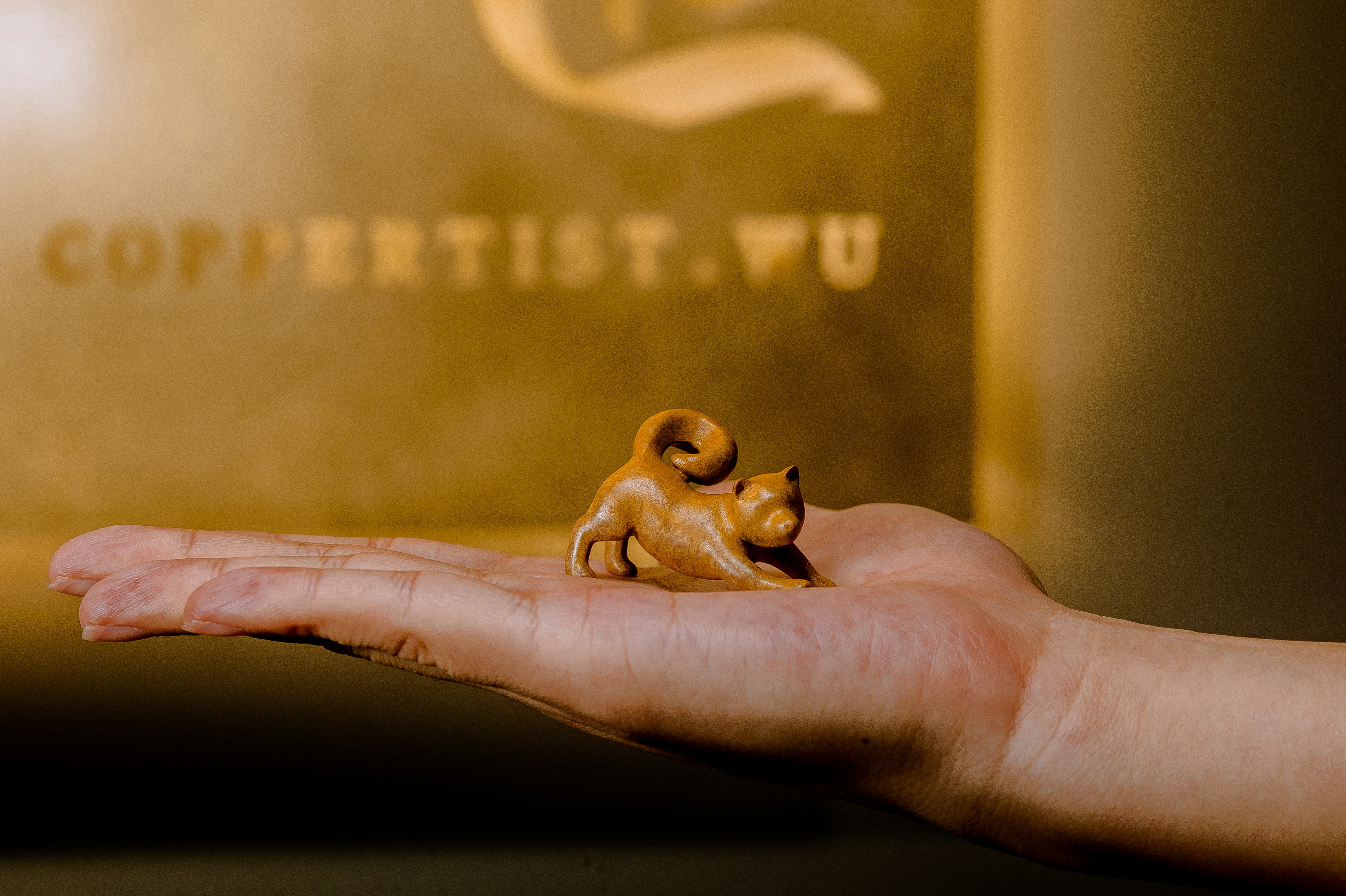 Palm-Sized Ember: A Tiny Clay Dog Resting on a Warm Hand
