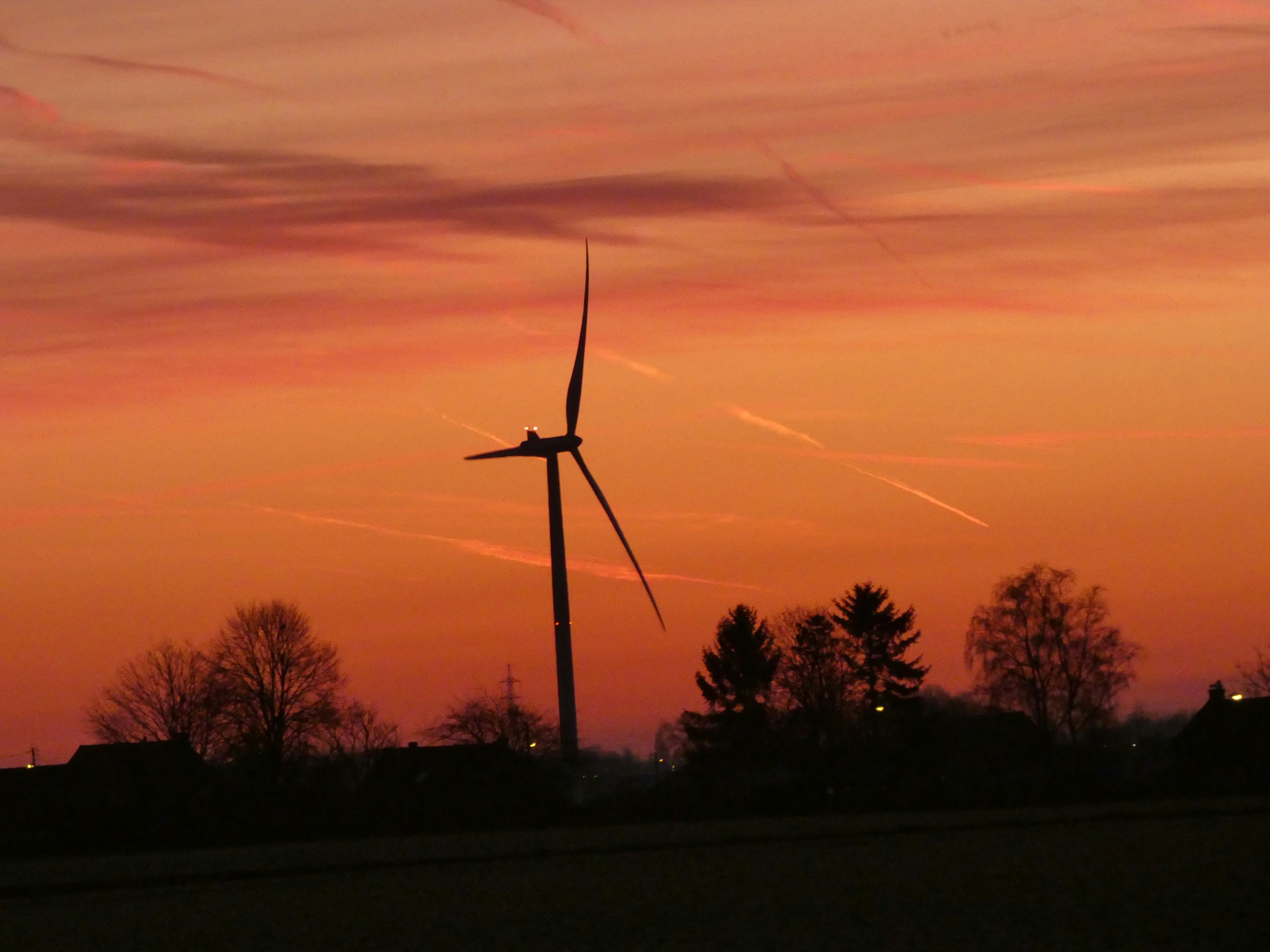 Turbine at Dusk: Ember Sky Over a Quiet Horizon