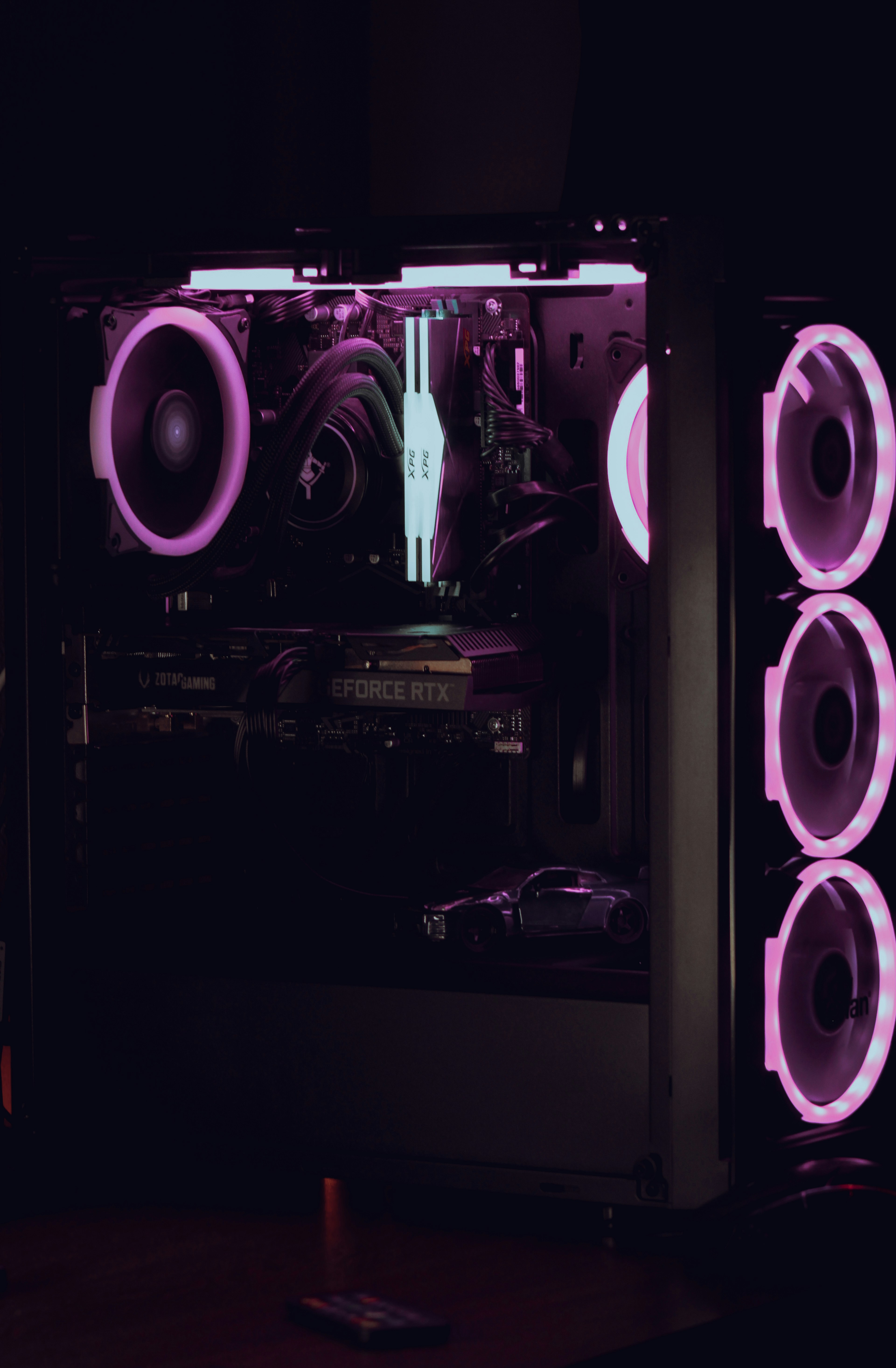 A computer case is lit up with purple lights photo – Free Gamer Image ...