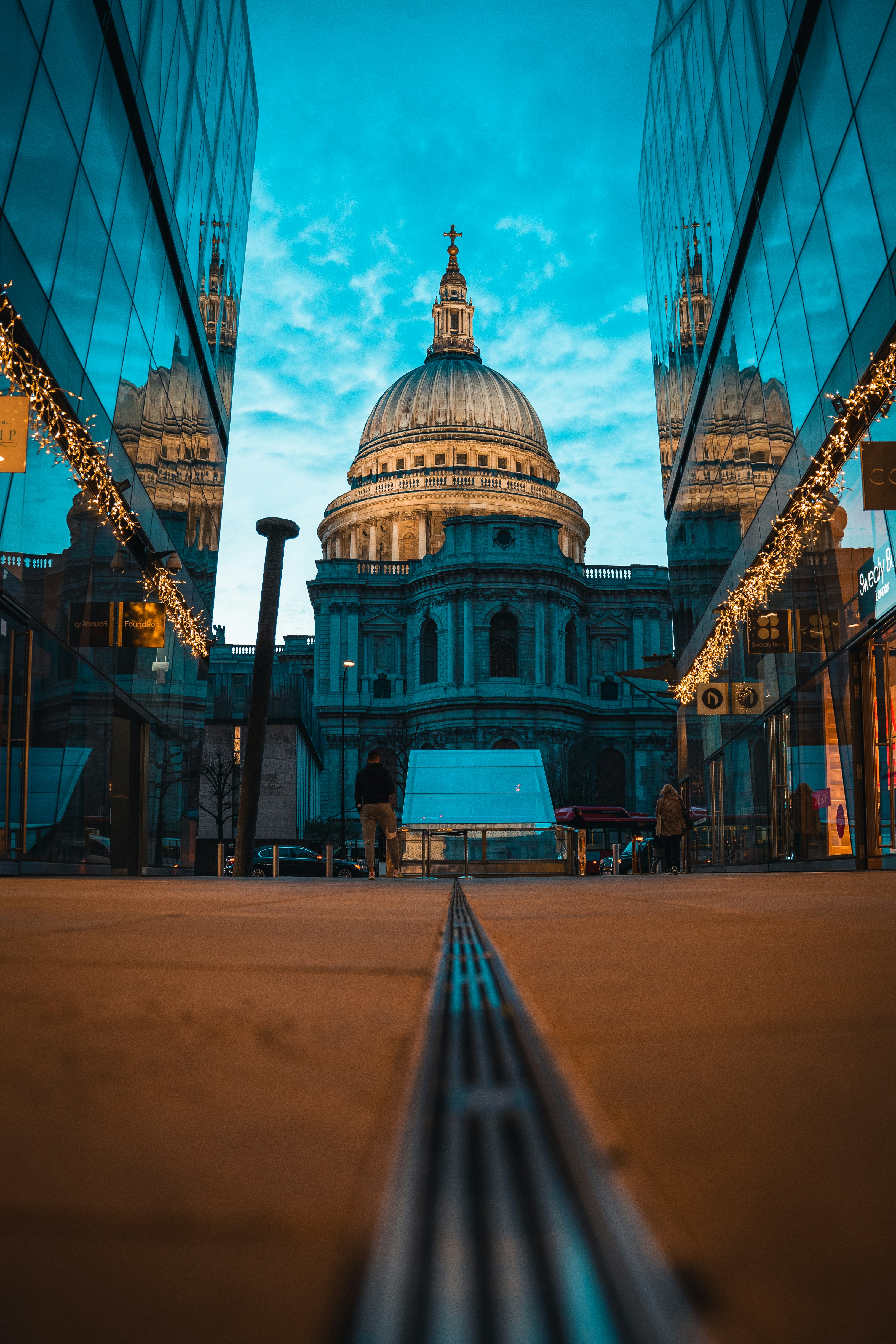 A view of a building with a domed building in the background photo ...