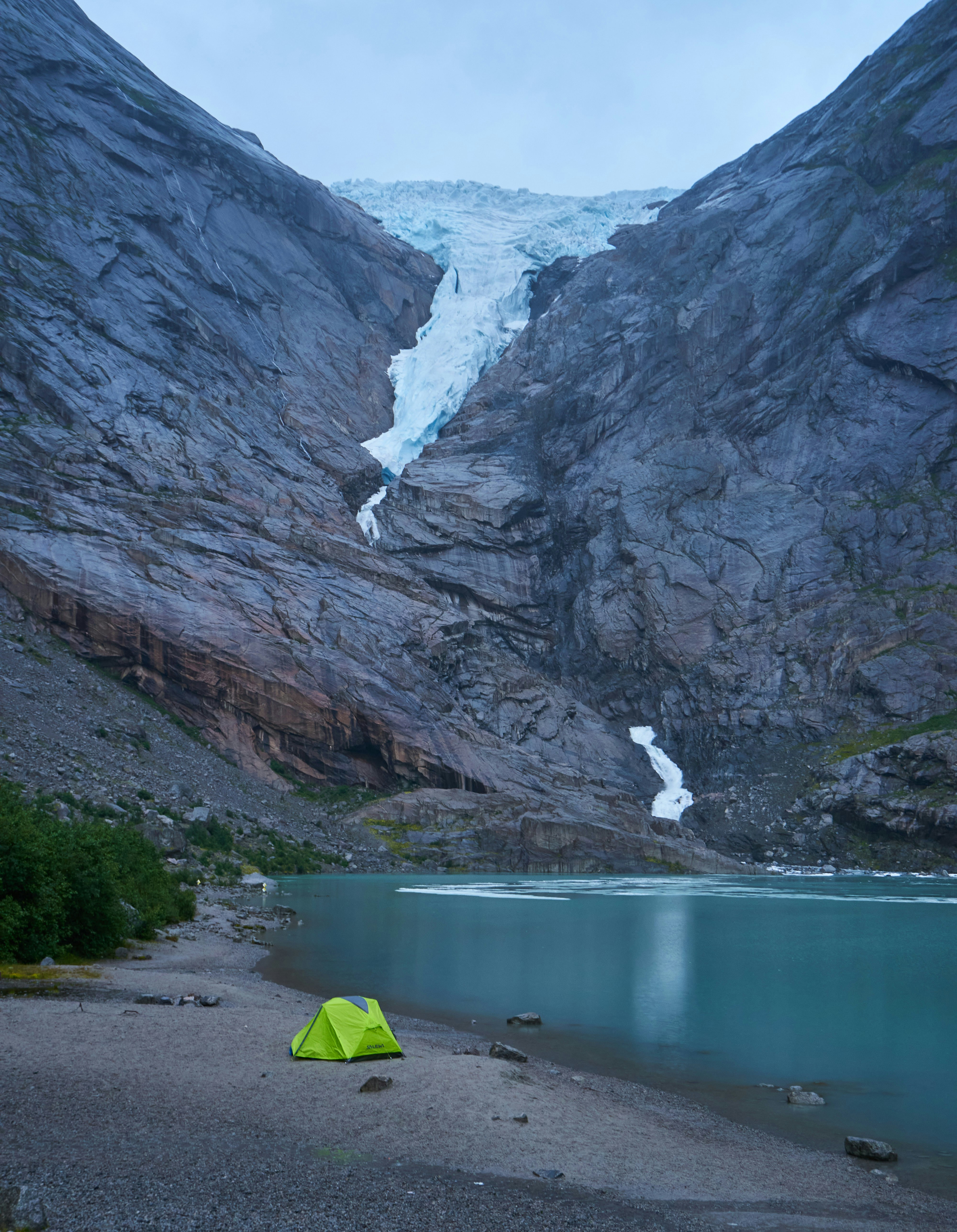 Neon Refuge at the Foot of a Jade Glacier