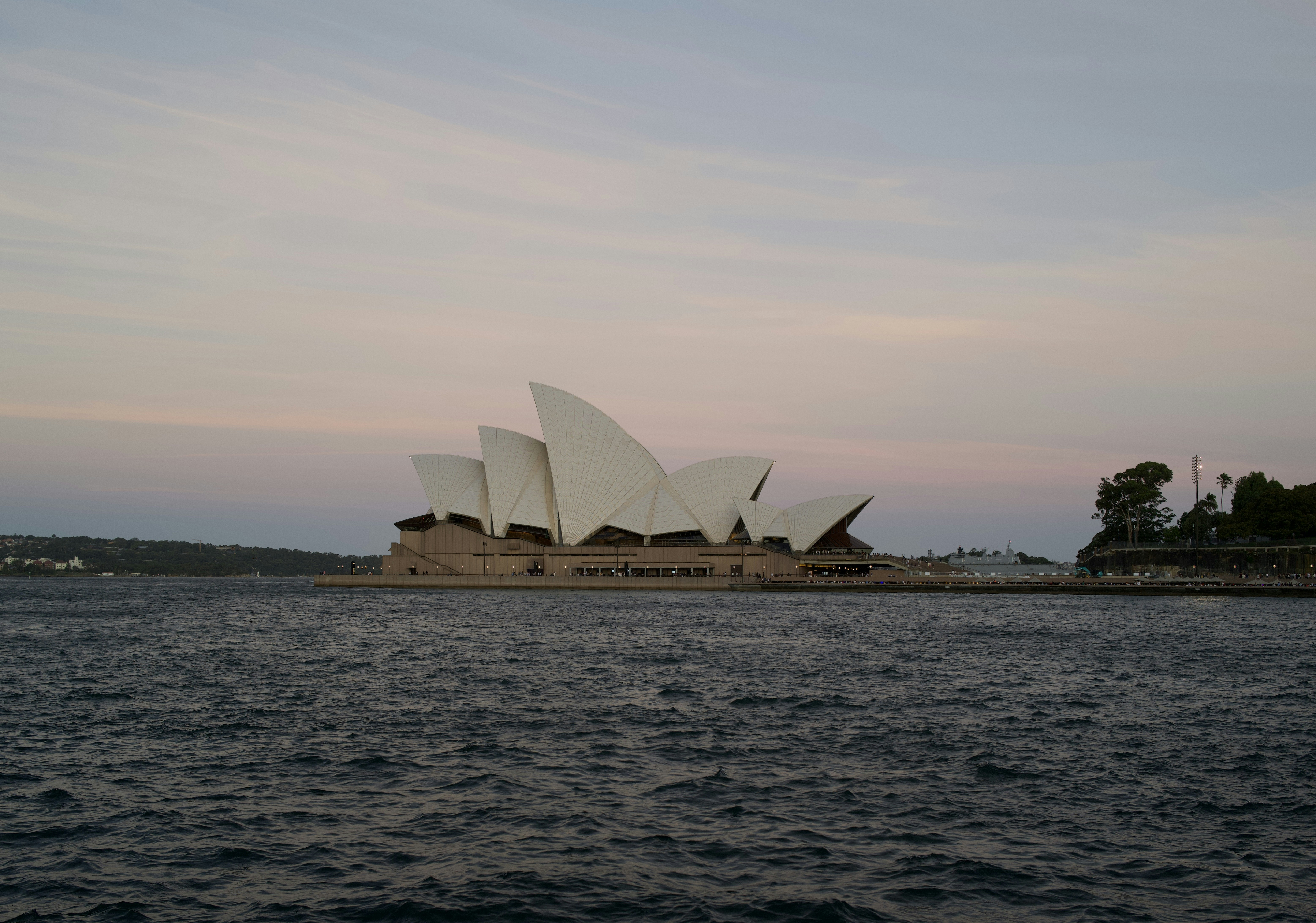 The sydney opera house in the middle of a body of water photo – Free ...