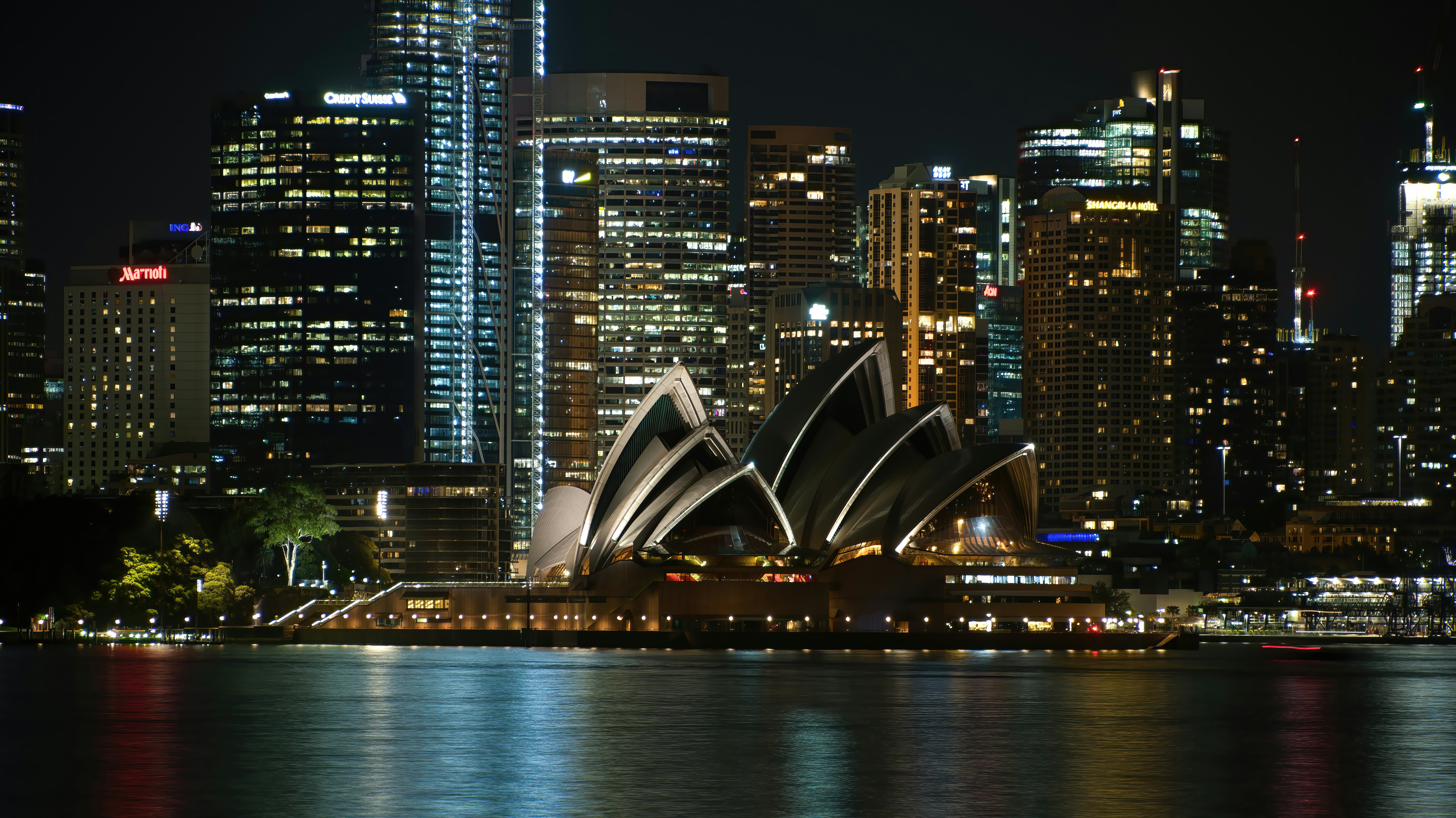 The city skyline is lit up at night photo – Free Sydney opera house ...