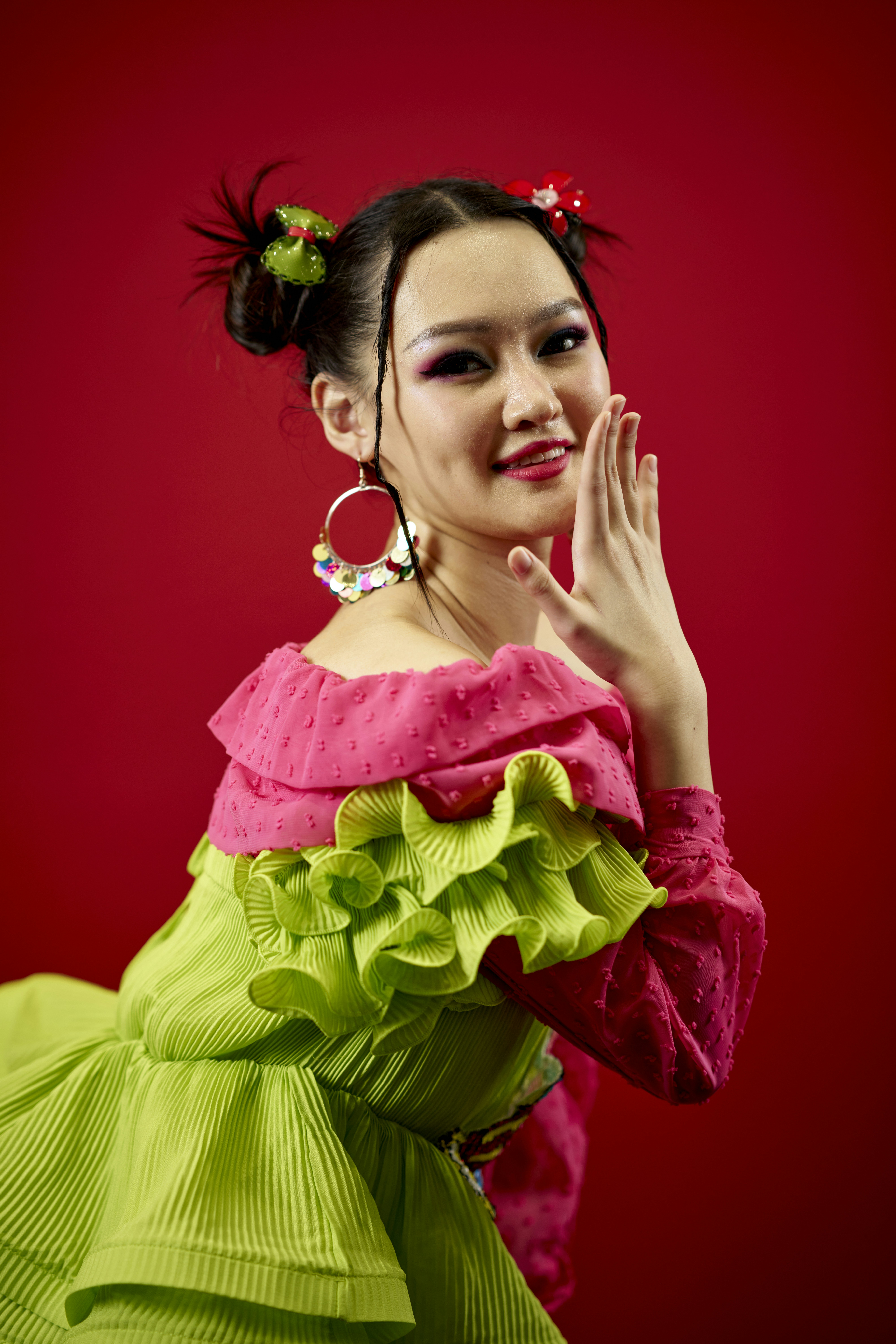 Crimson Backdrop, Lime Ruffles: A Portrait of Playful Glamour