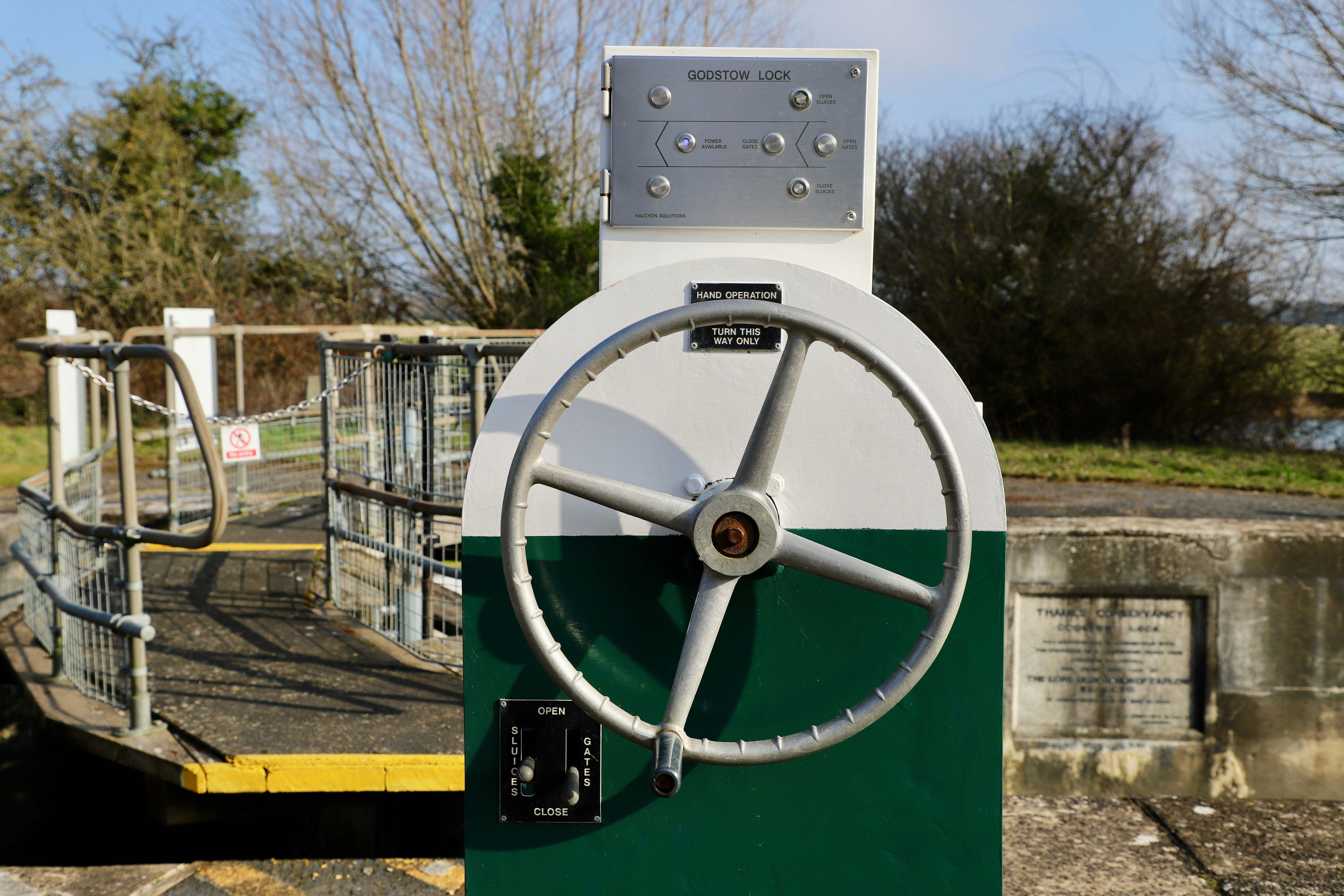 Goodtown Lock Wheel: Weathered Steel at the Canal Gate Beneath a Bright Sky