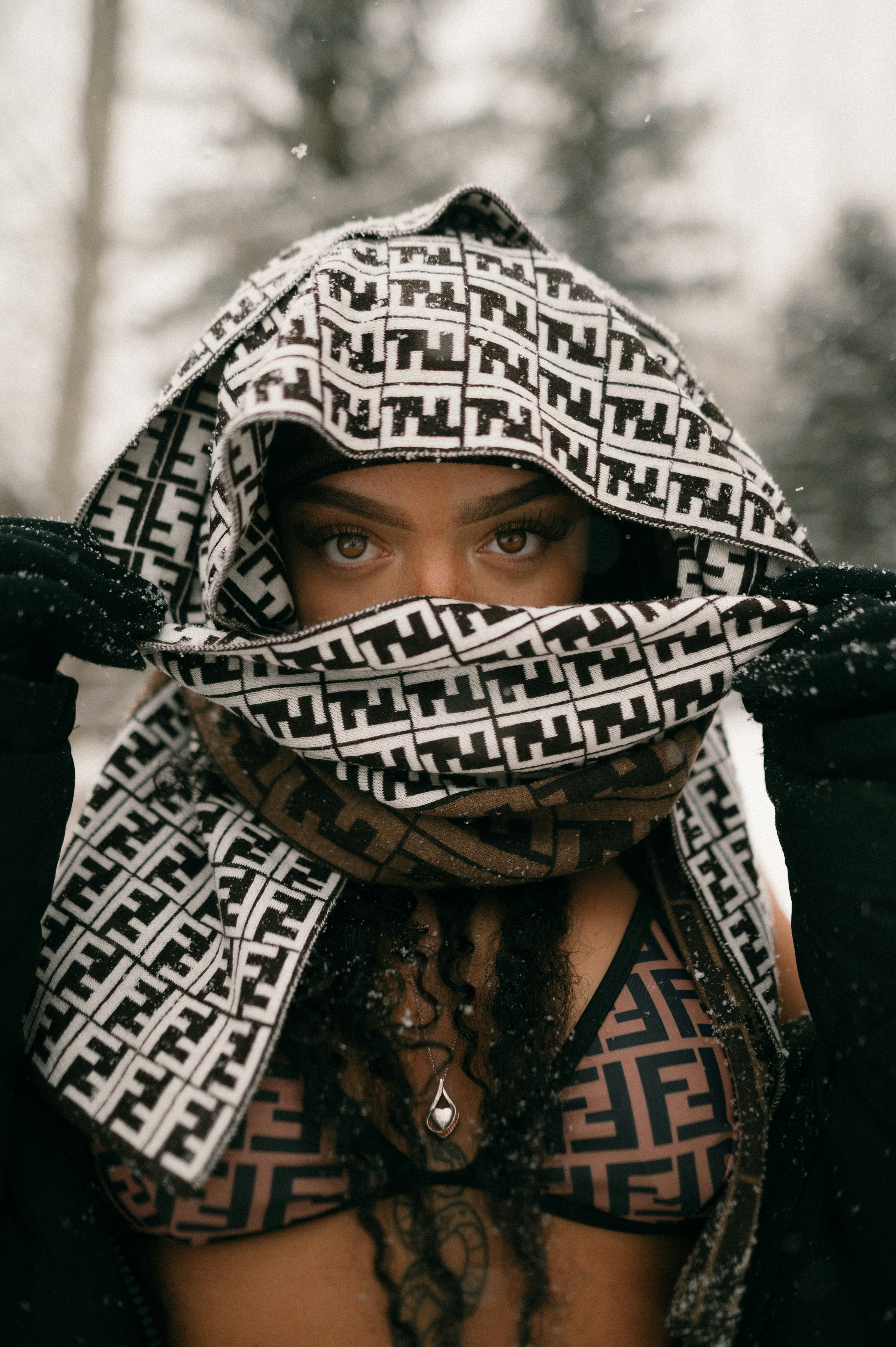 Gaze Through the Monogram: Winter Portrait Behind a Patterned Veil