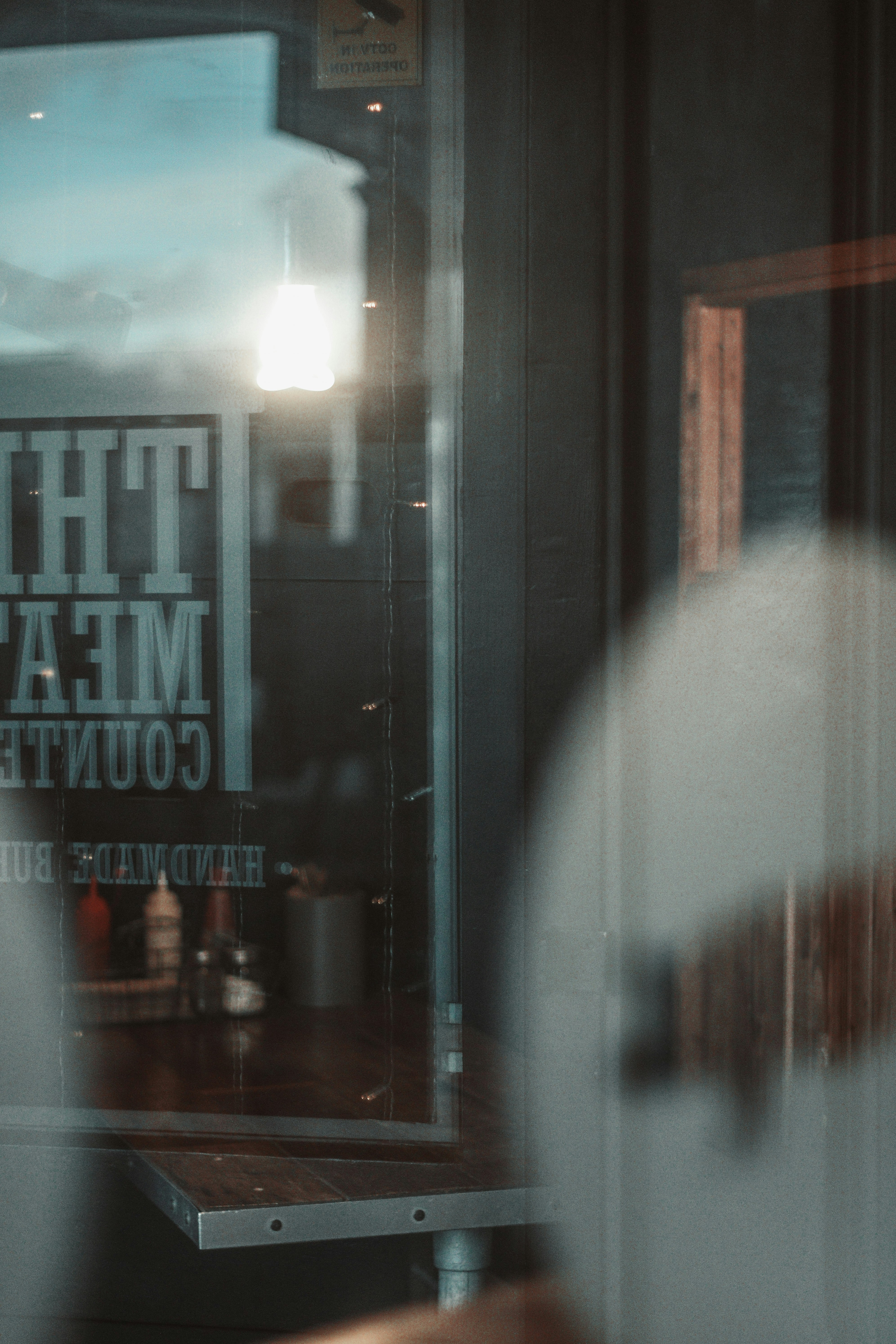 Reflections in a Dim storefront window
