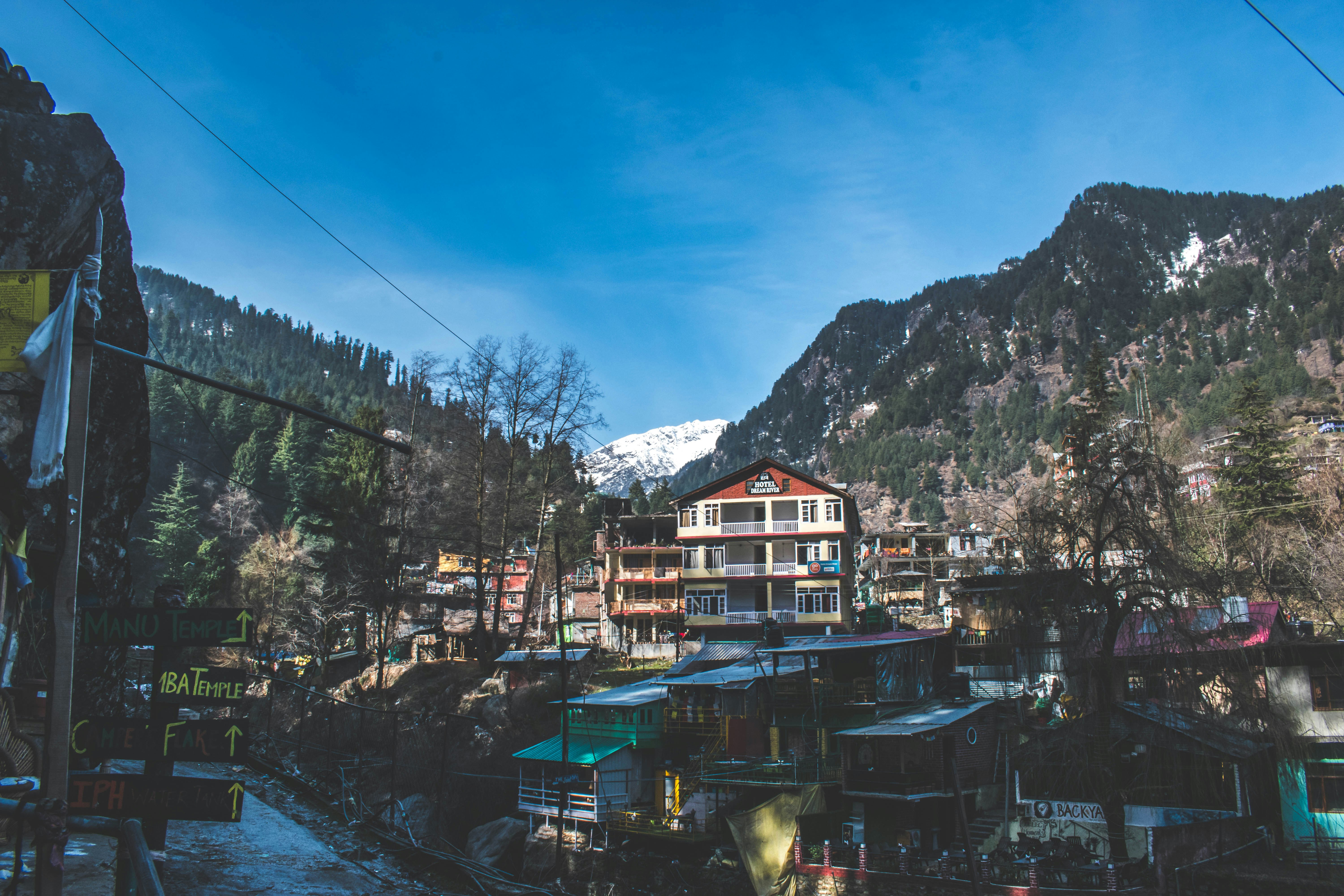 a group of houses sitting on the side of a mountain