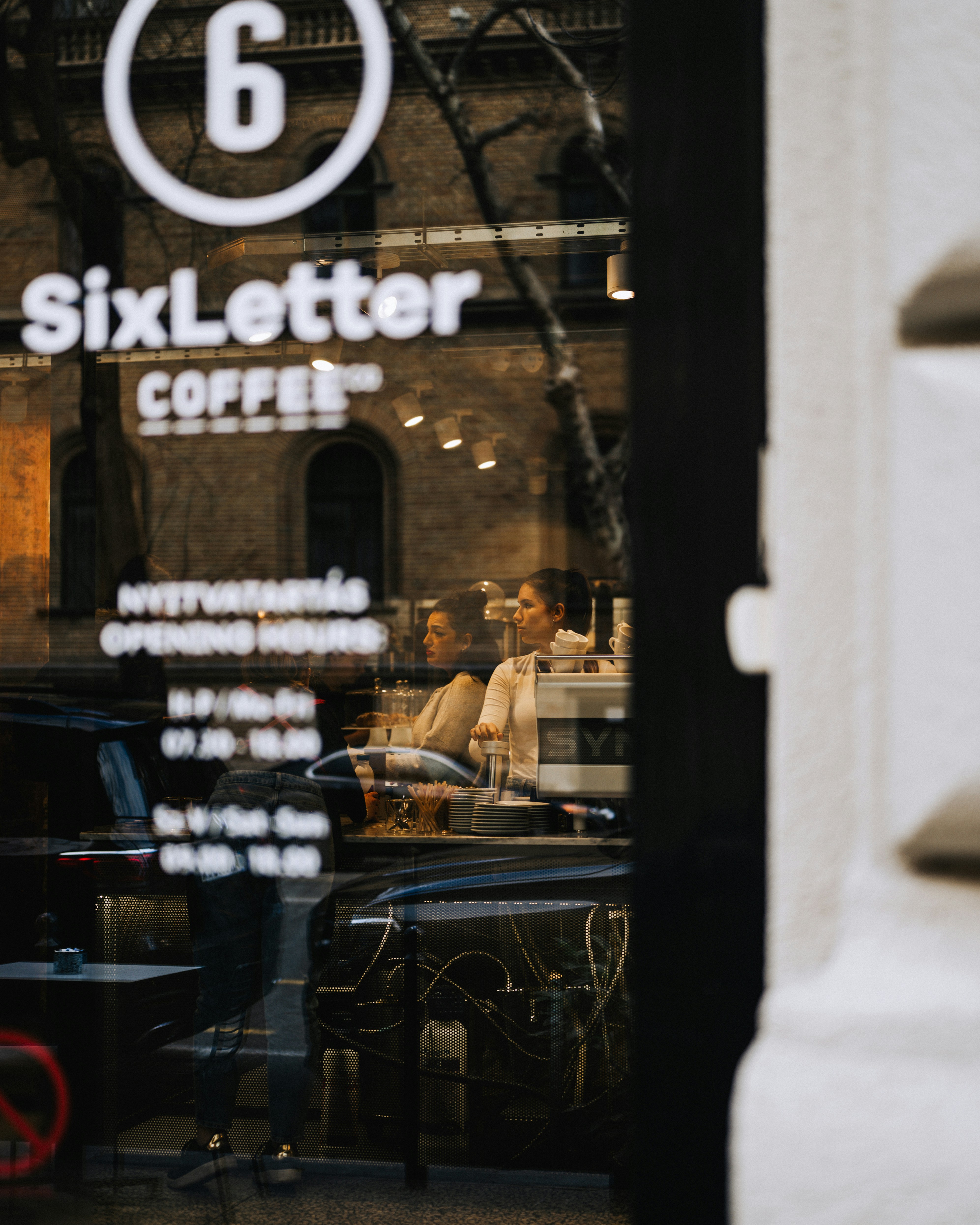 Through Glass at SixLetter Coffee: Steam and Signage in Soft Focus