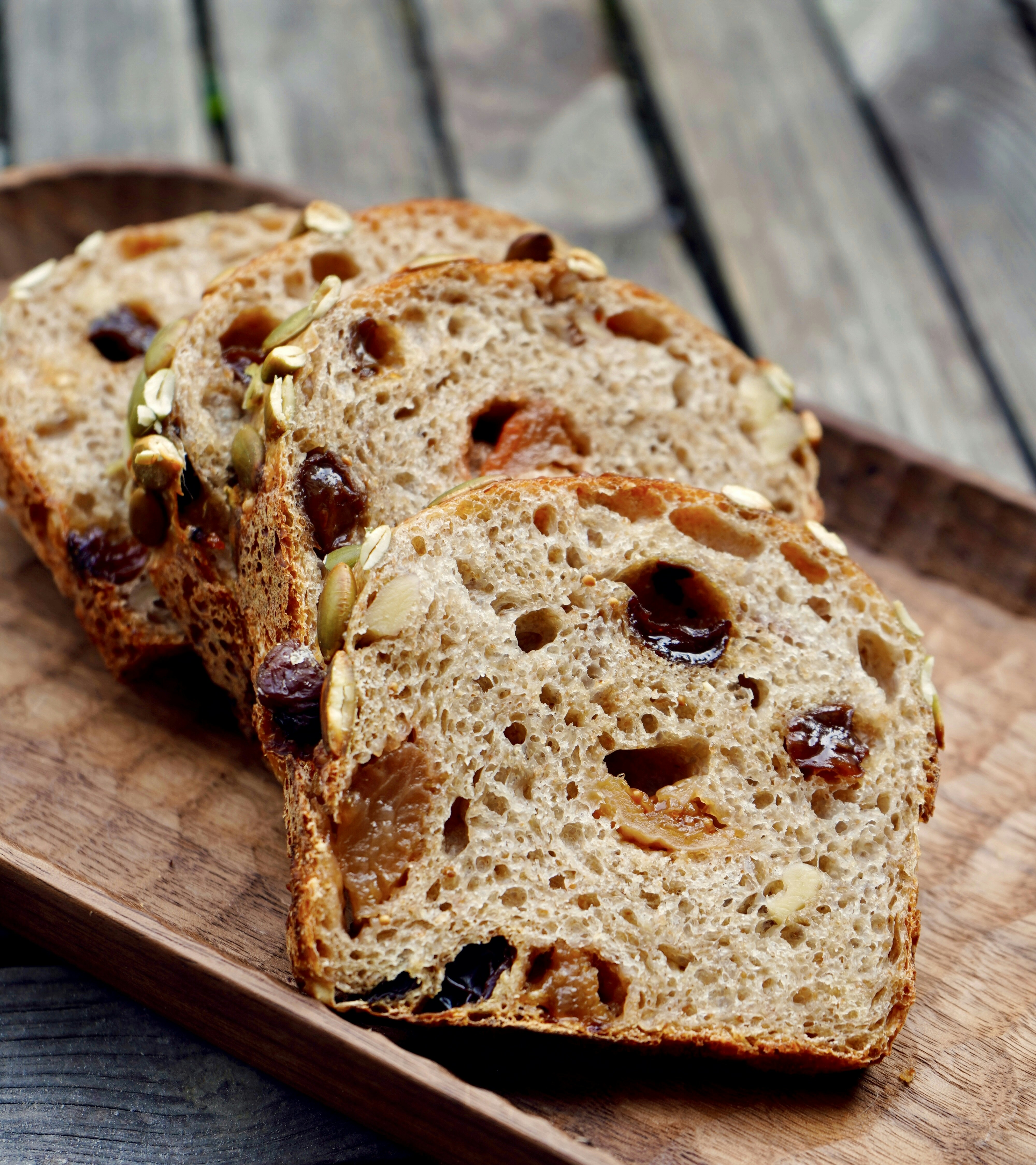 Two slices of bread on a wooden tray photo – Free Bread Image on Unsplash