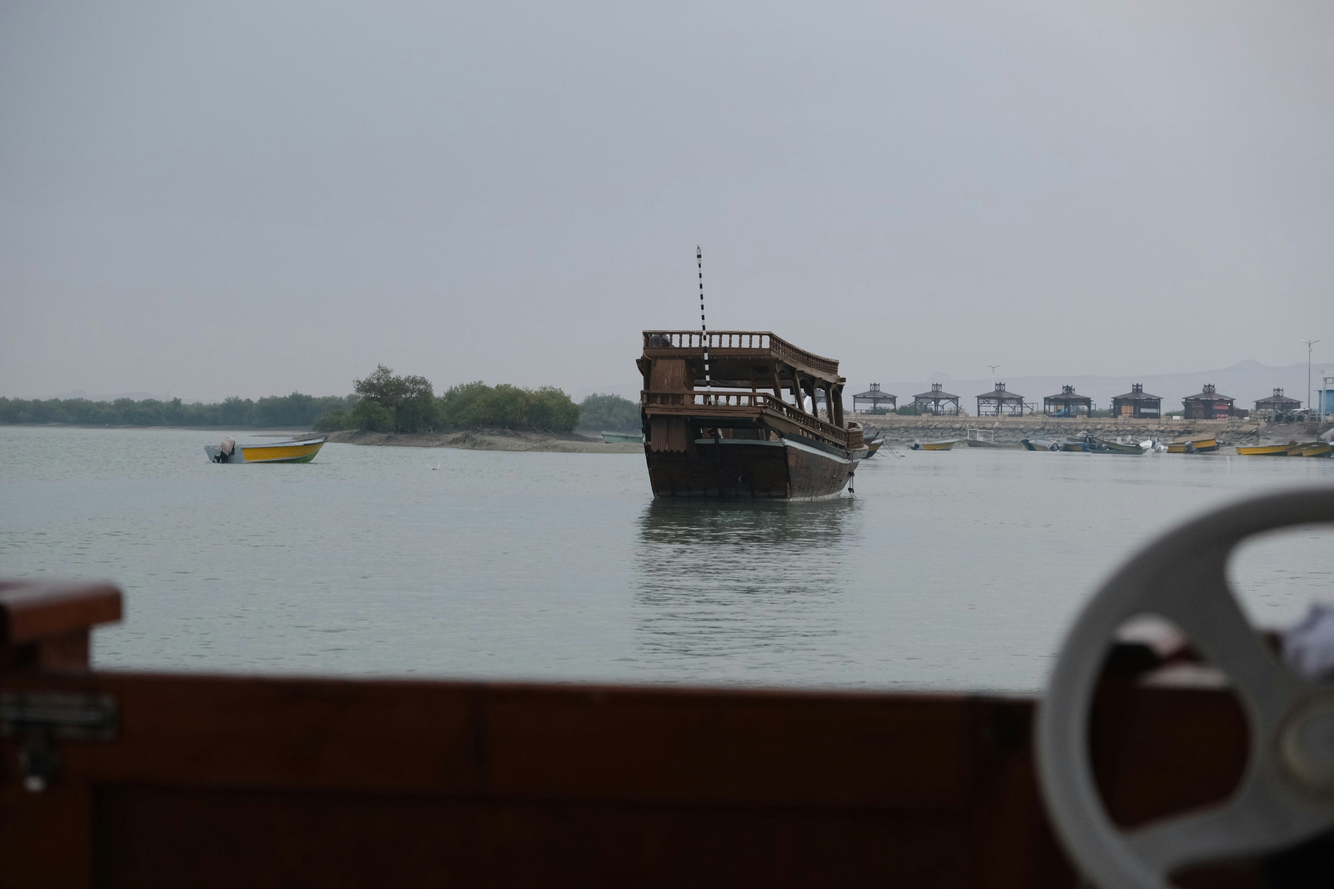 The Old Vessel and the Quiet Riverfront