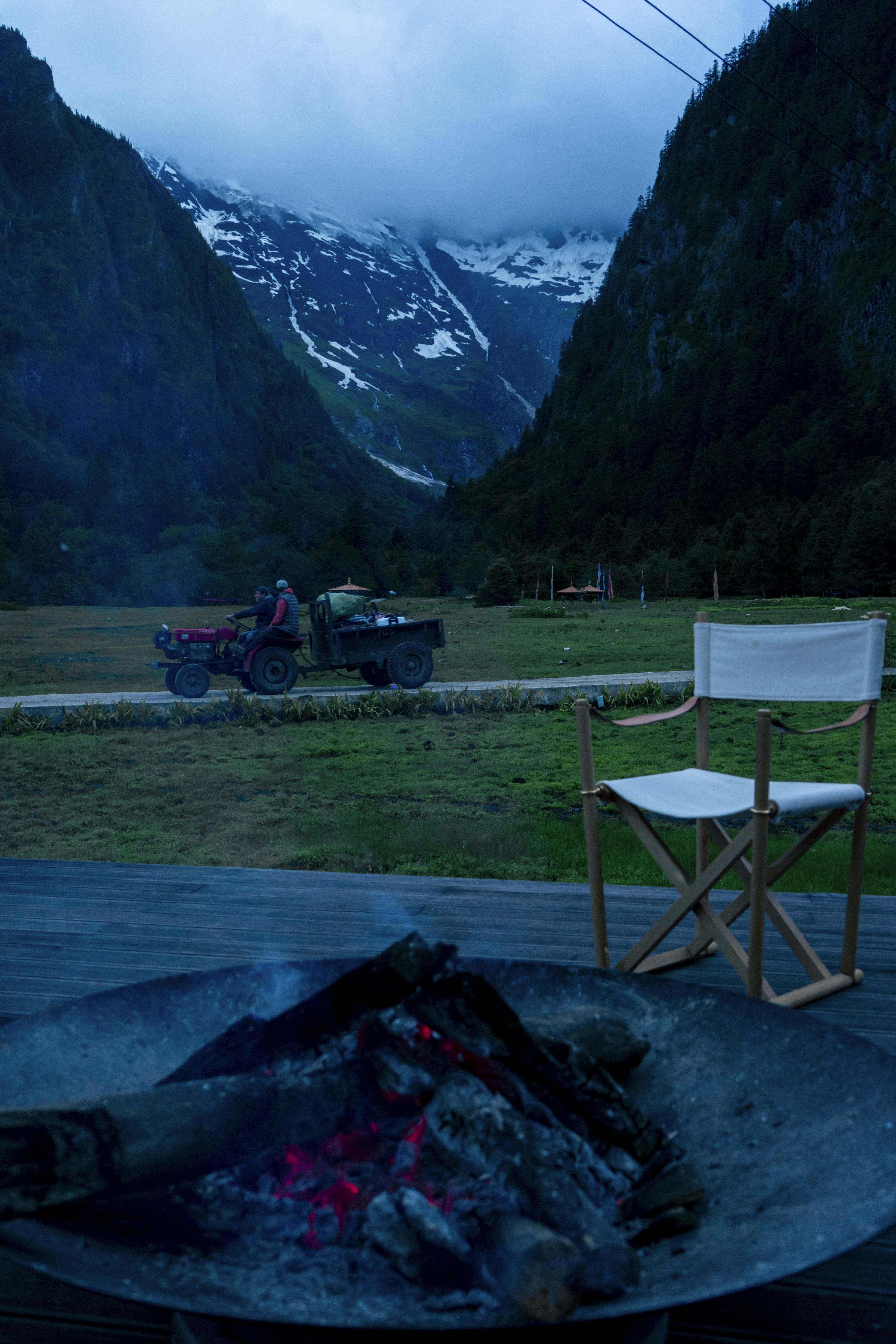 Valley Campfire Beneath Snow-Dusted Giants