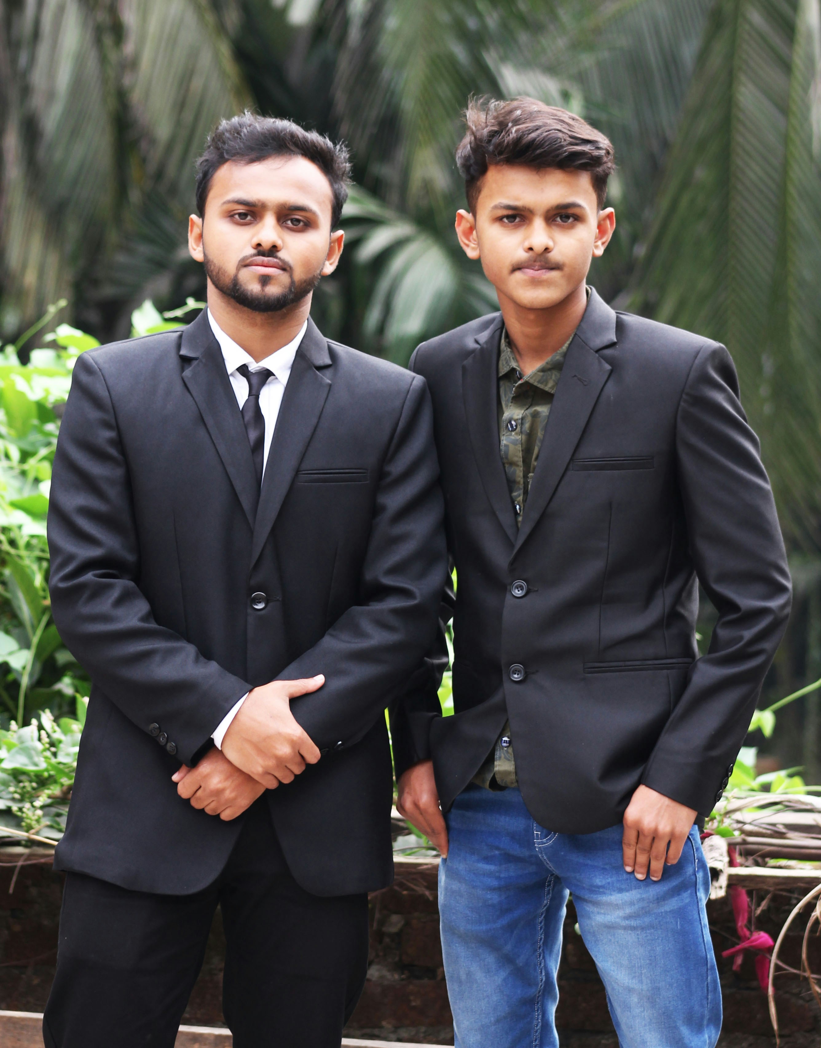 Suits in Sync: A Quiet Portrait of Two Young Gentlemen