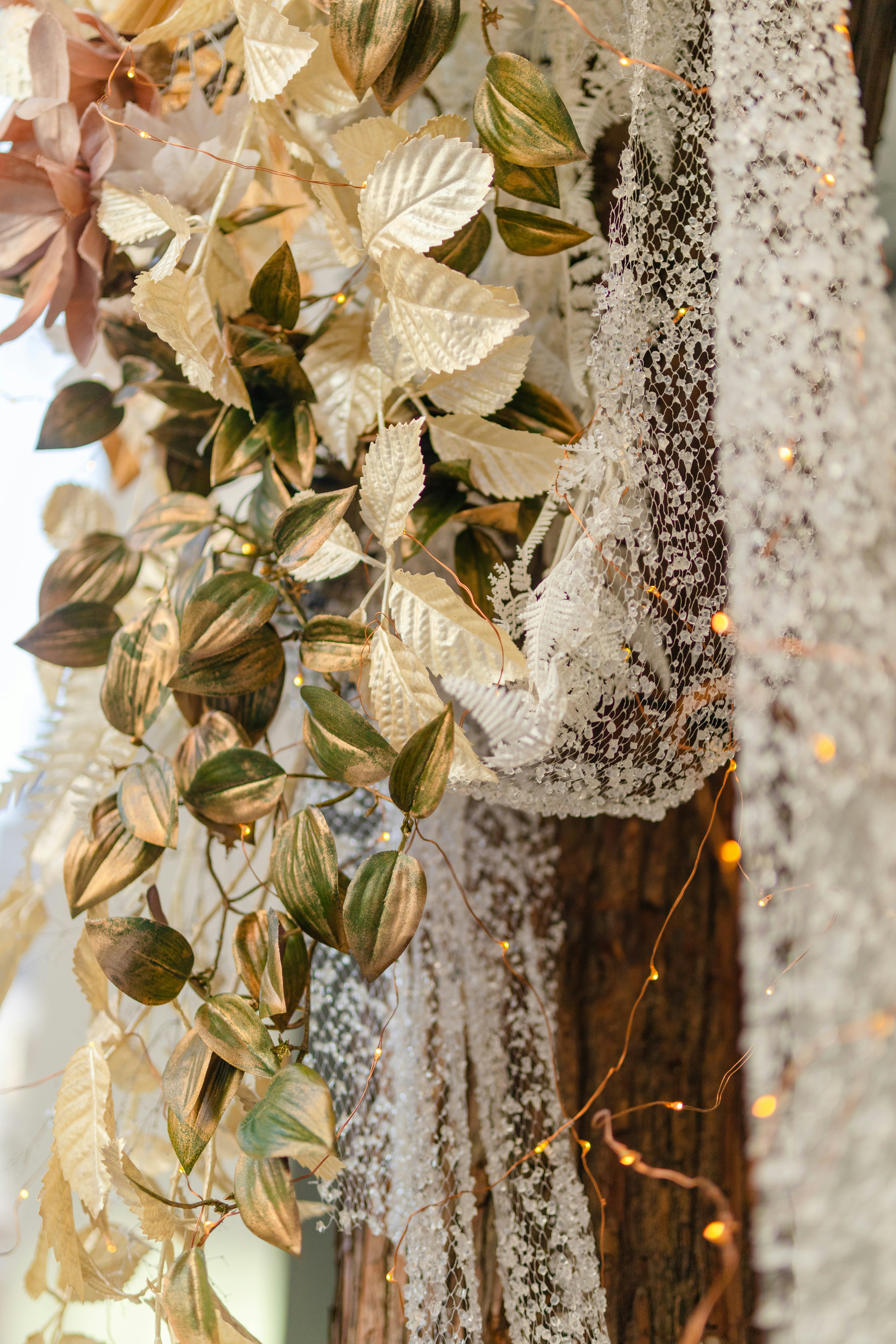 Ivory Lace and Verdant Veins: A Close-Up of a Holiday Garland Glow