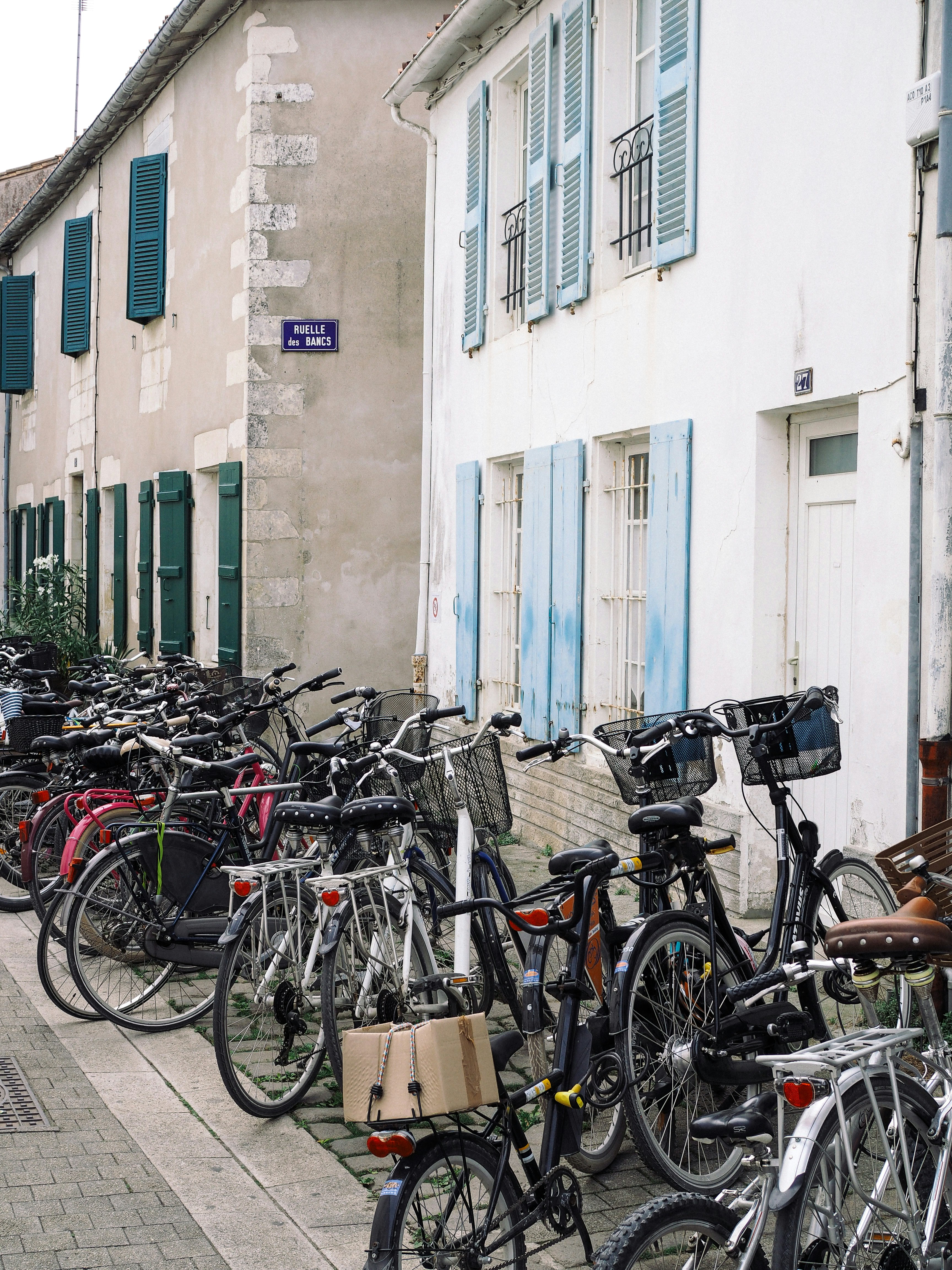 Bicycle Cascade Along a Sunlit European Lane