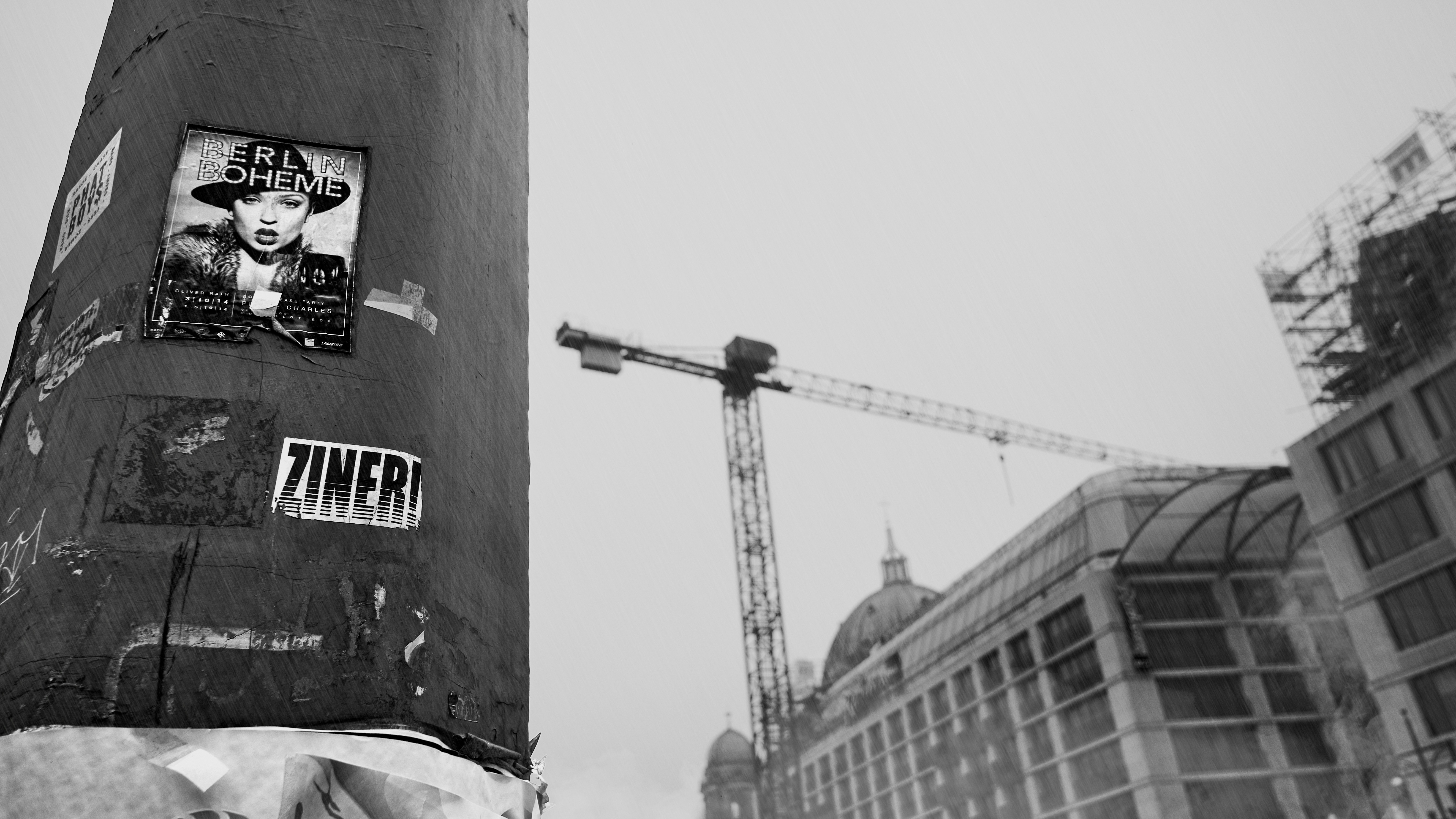 Stickered Pole in the Shadow of a Construction Crane