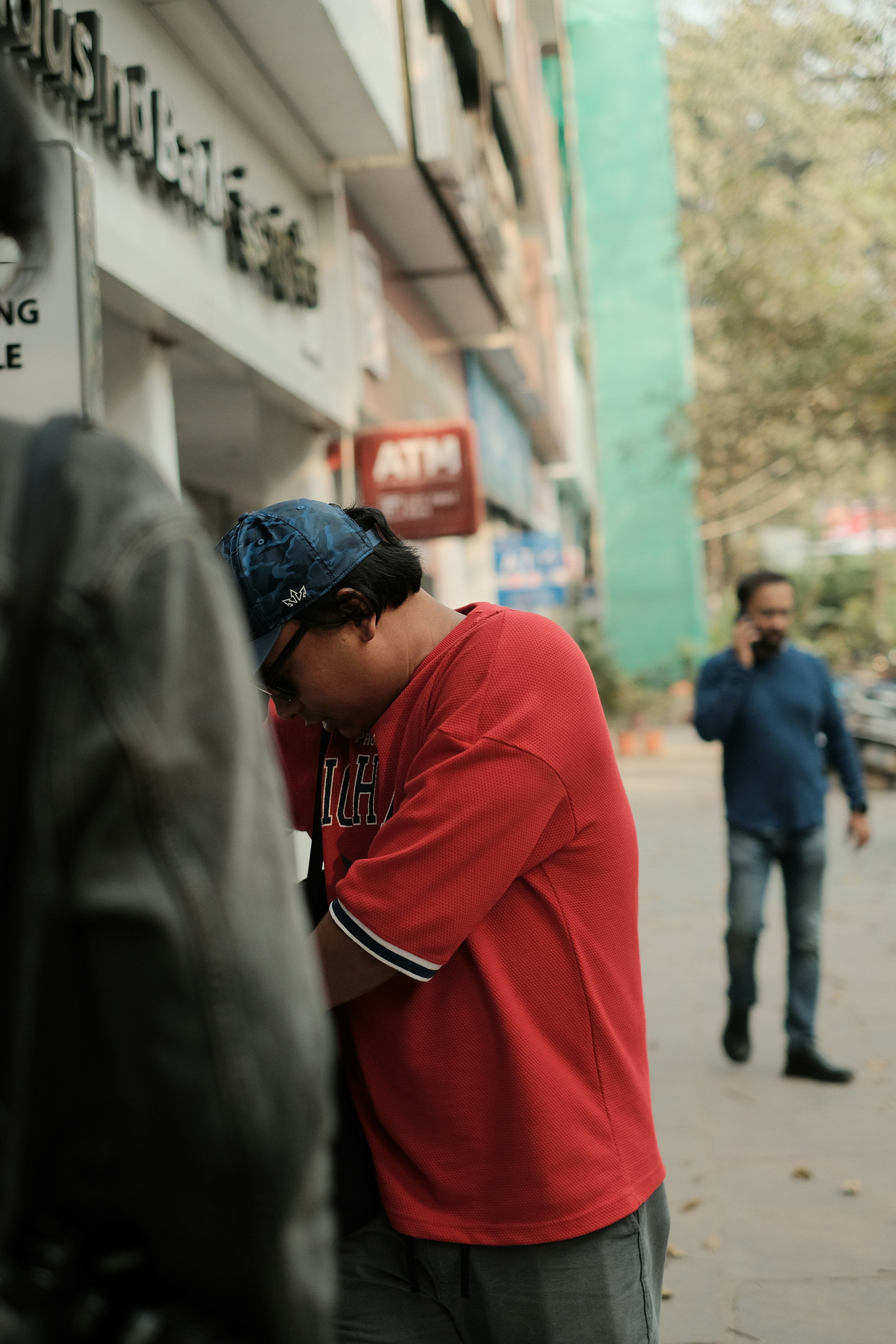 Red-Sleeved Moment: Street Portrait in Transit