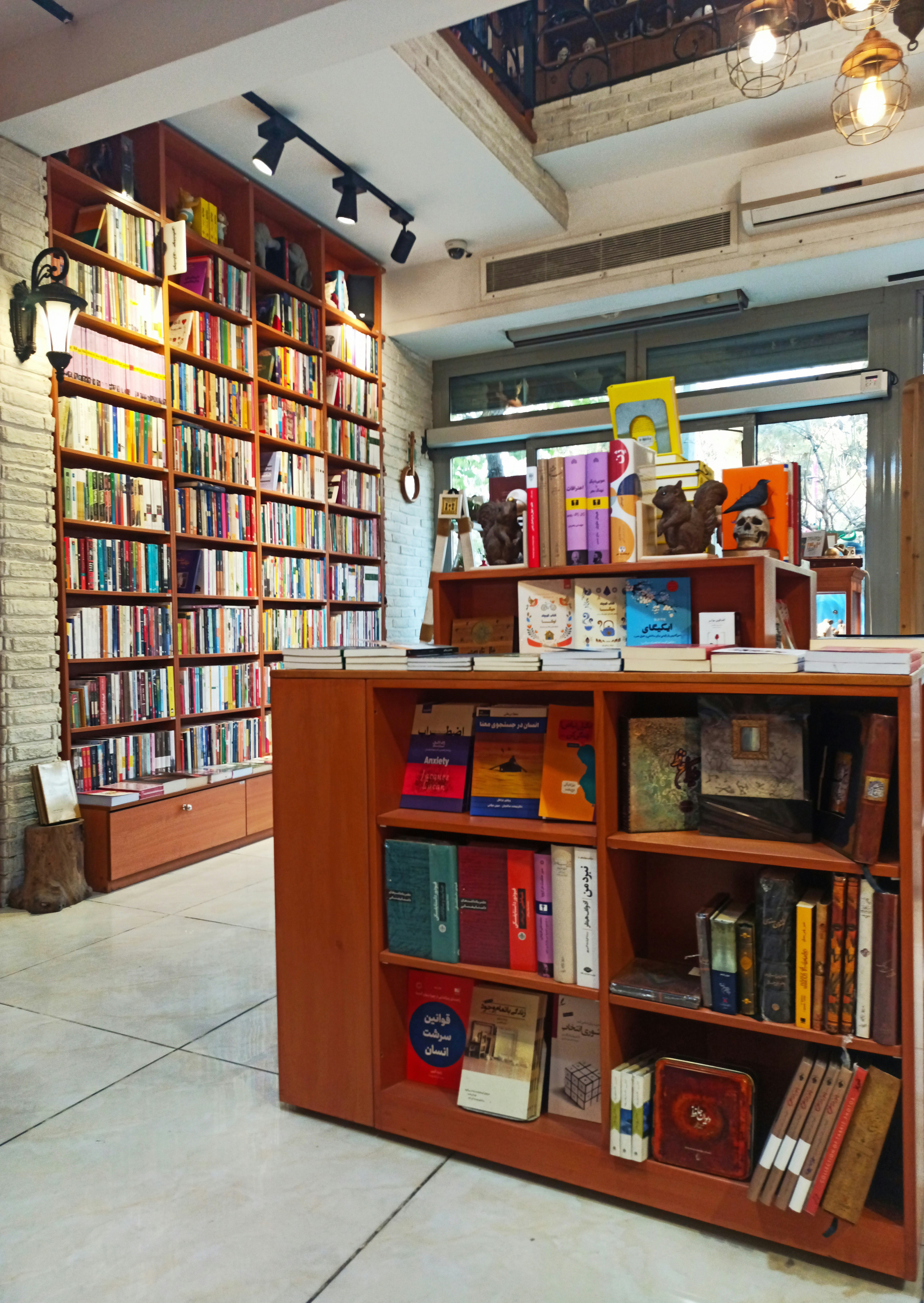 A bookshelf filled with lots of books in a library photo – Free ...