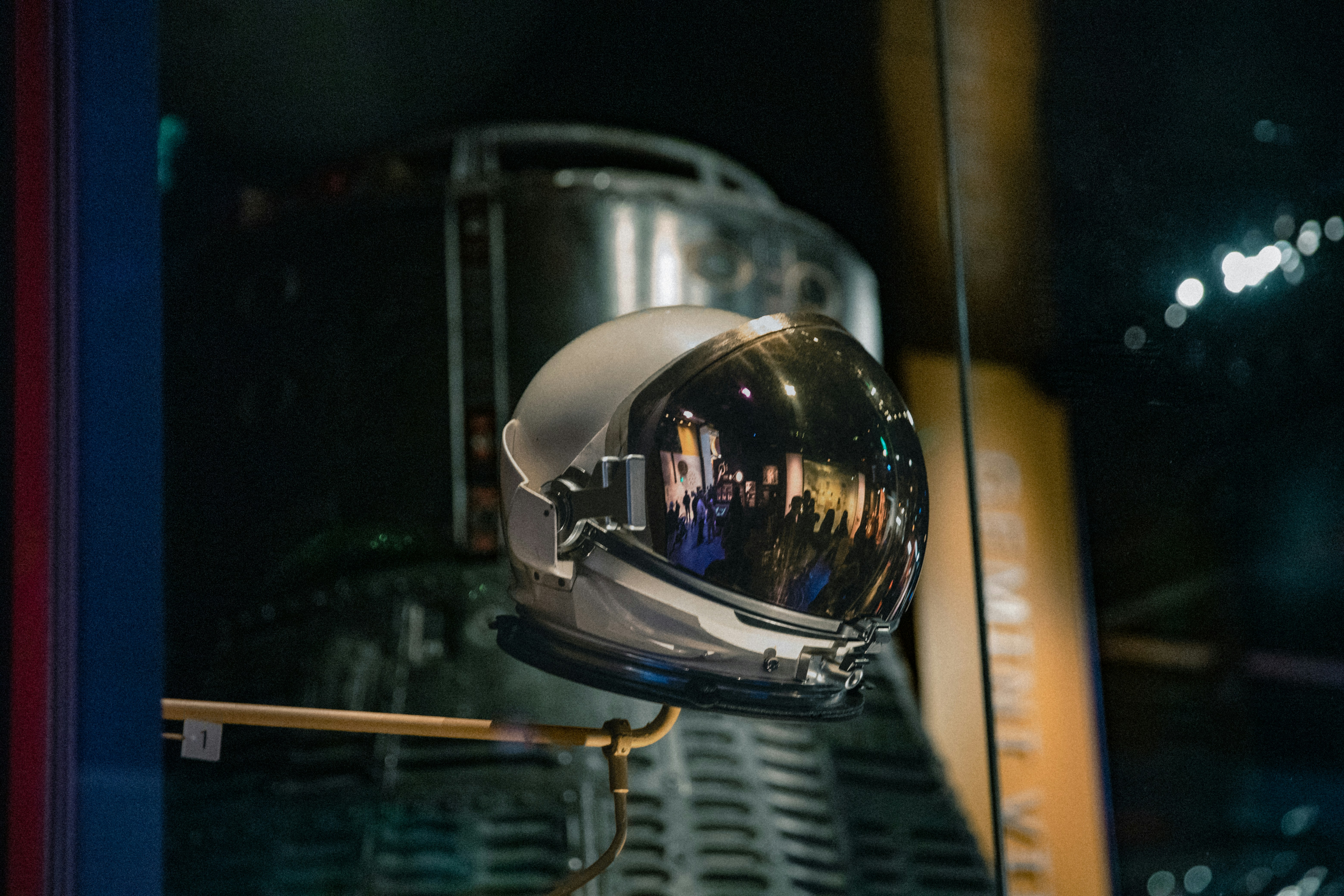 Reflections in a Spacewalk: A Display Helmet in a Dim Gallery