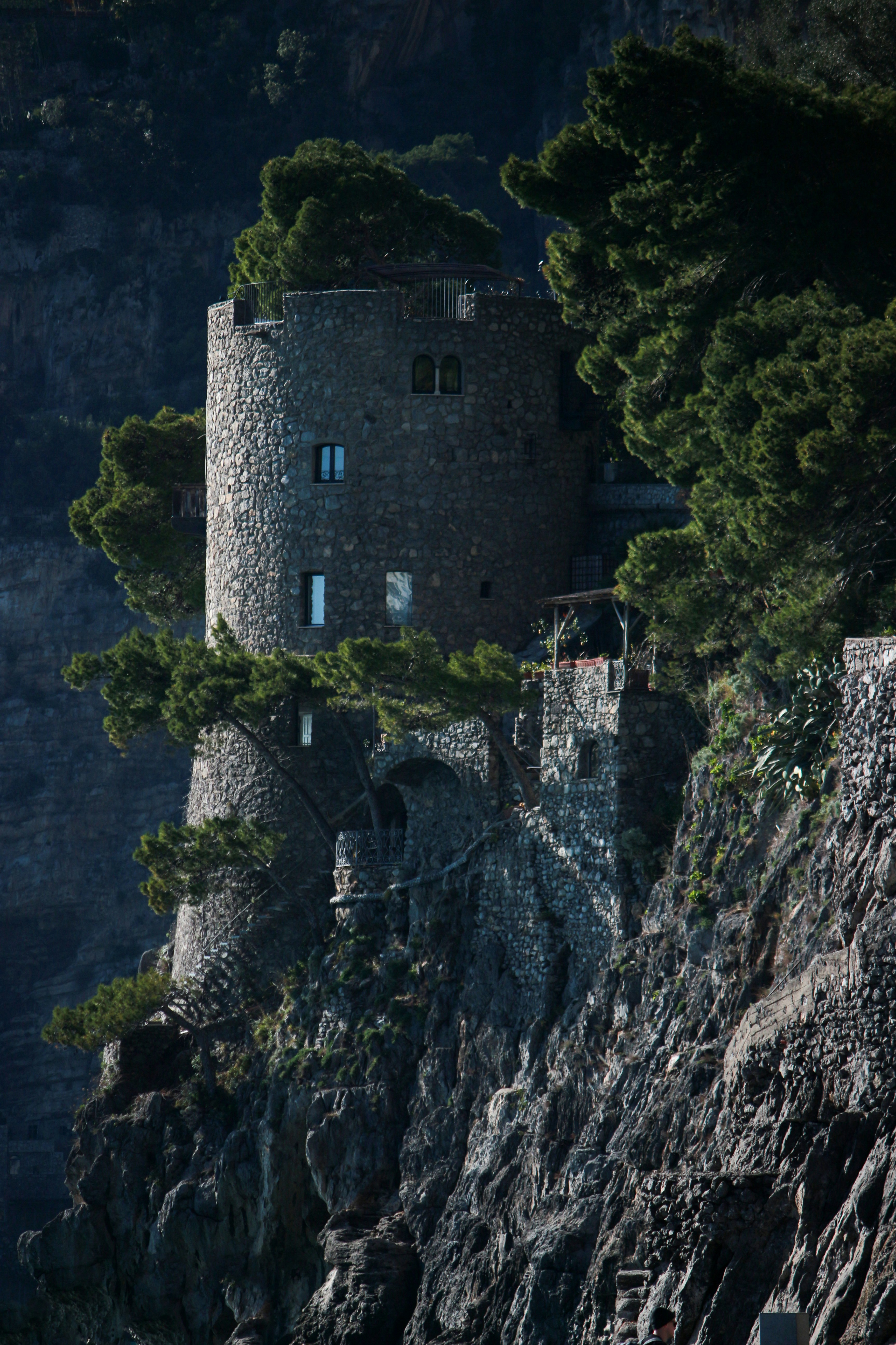 Cliffside Watchtower Wrapped in Pines at Blue Hour