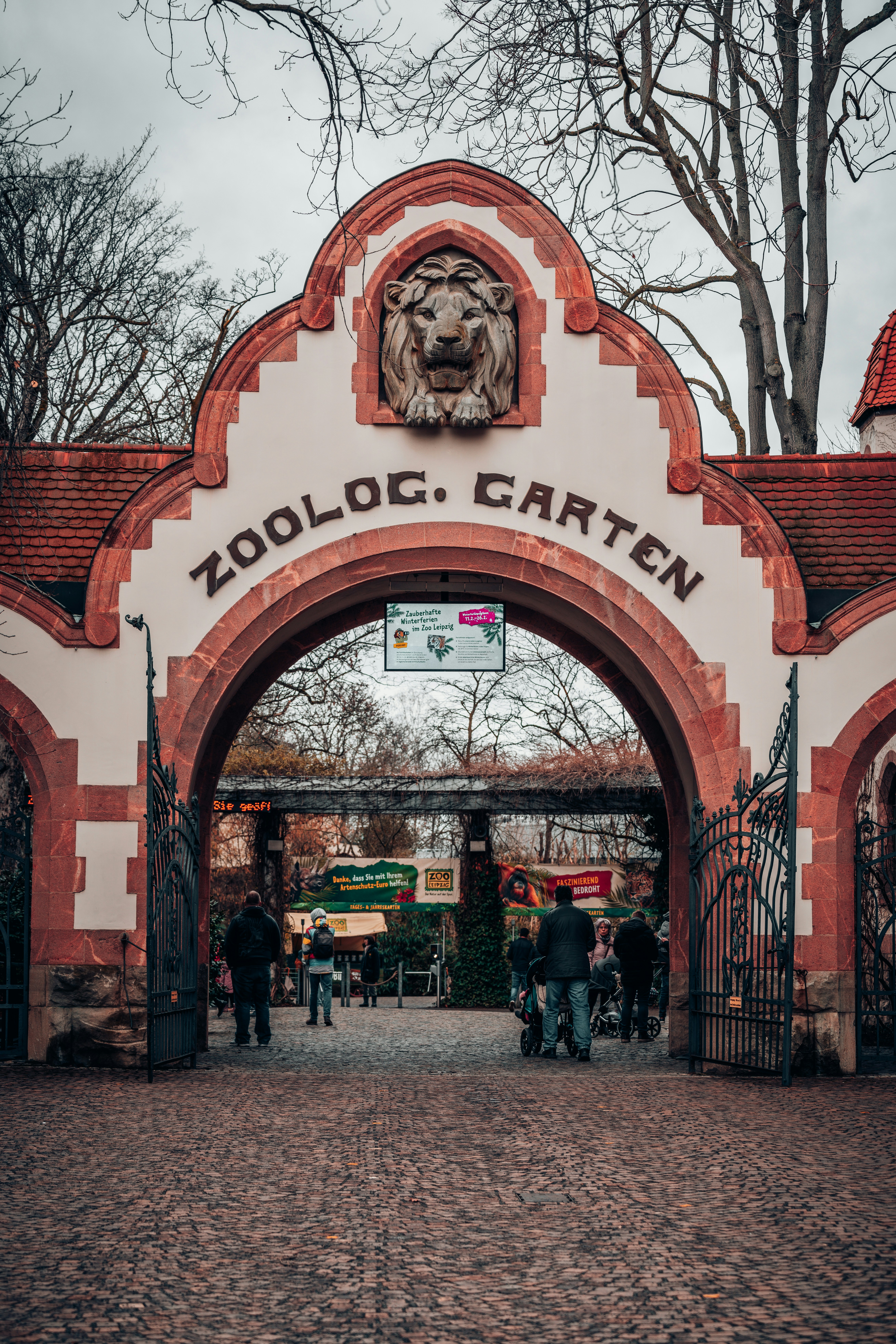 A zoo entrance with a lion head on it photo – Free Leipzig Image on ...