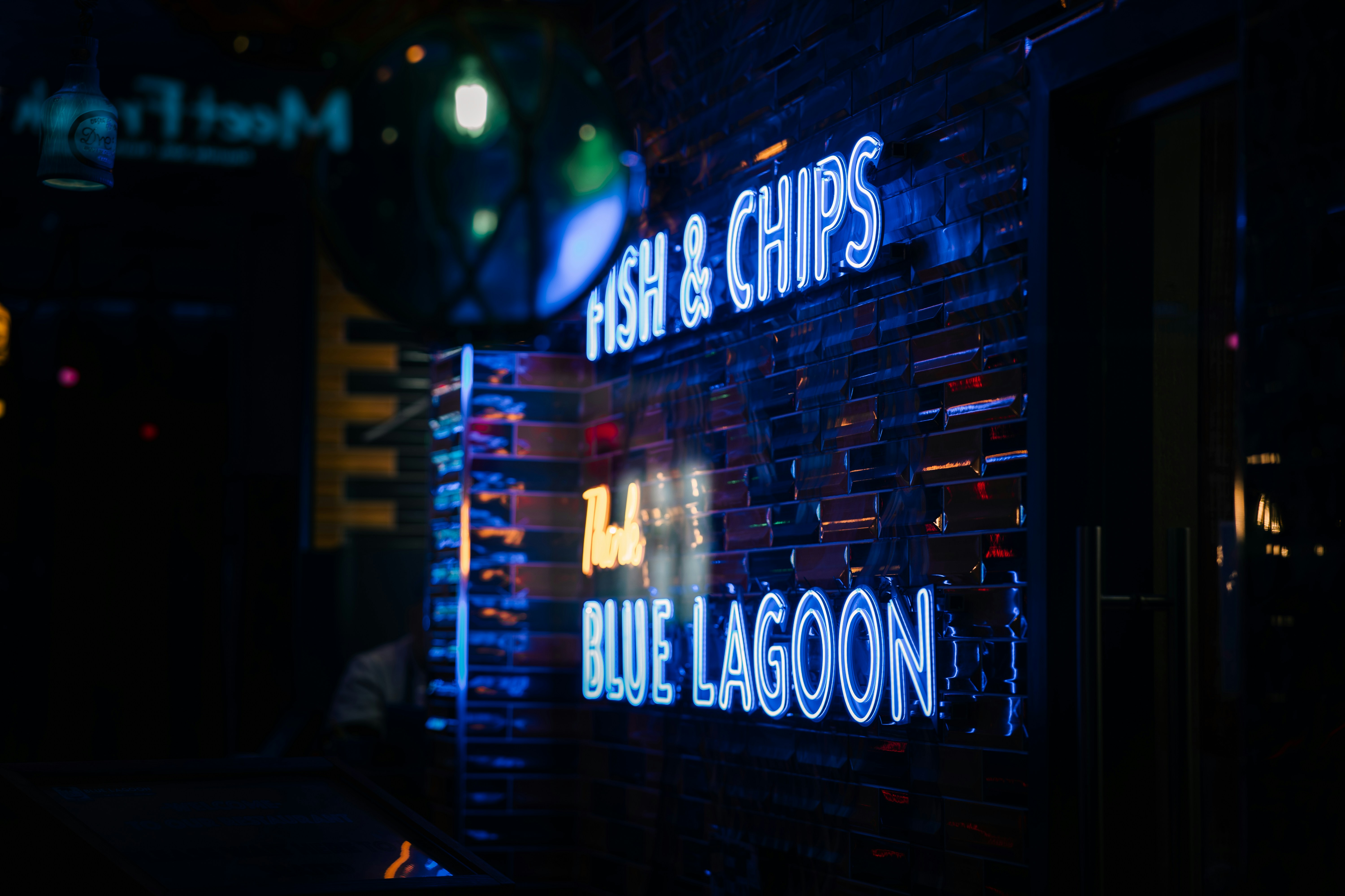 A neon sign that reads fish and chips blue lagoon photo – Free Urban ...